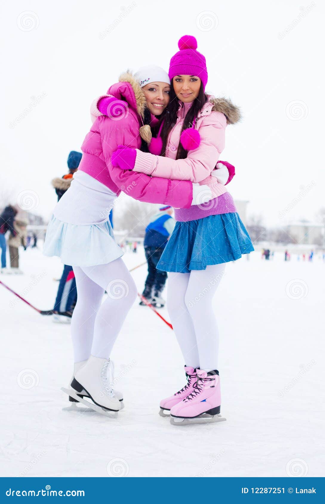 Two girls ice skating stock image. Image of shoes, joyful - 12287251
