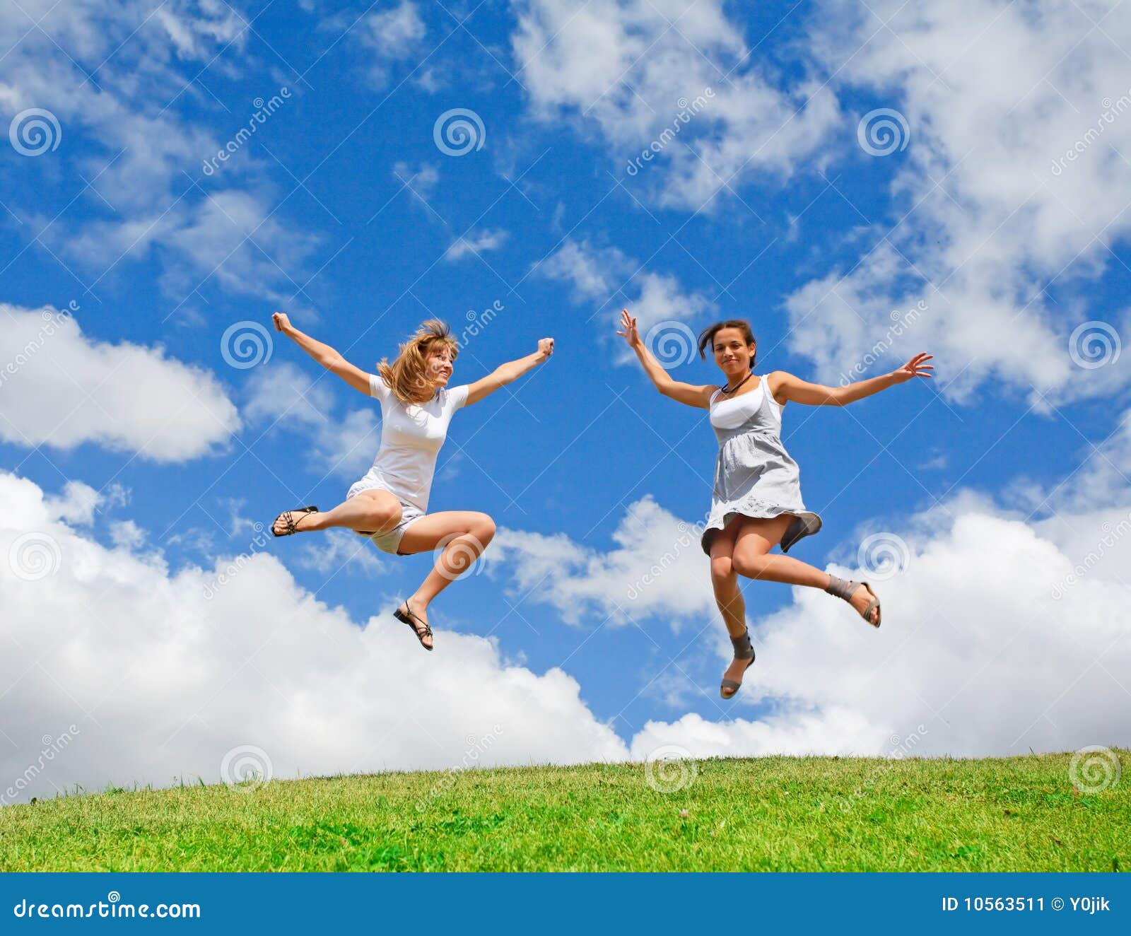Two girls jumping stock image. Image of entertainment - 10563511