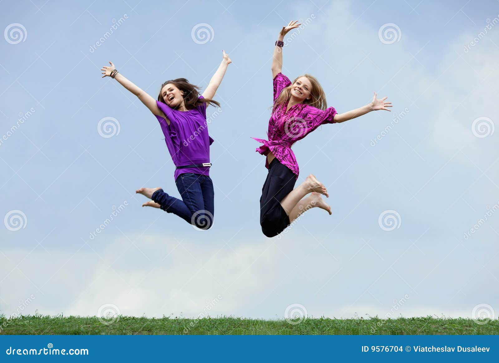 Two girls jumping stock photo. Image of positive, summer - 9576704