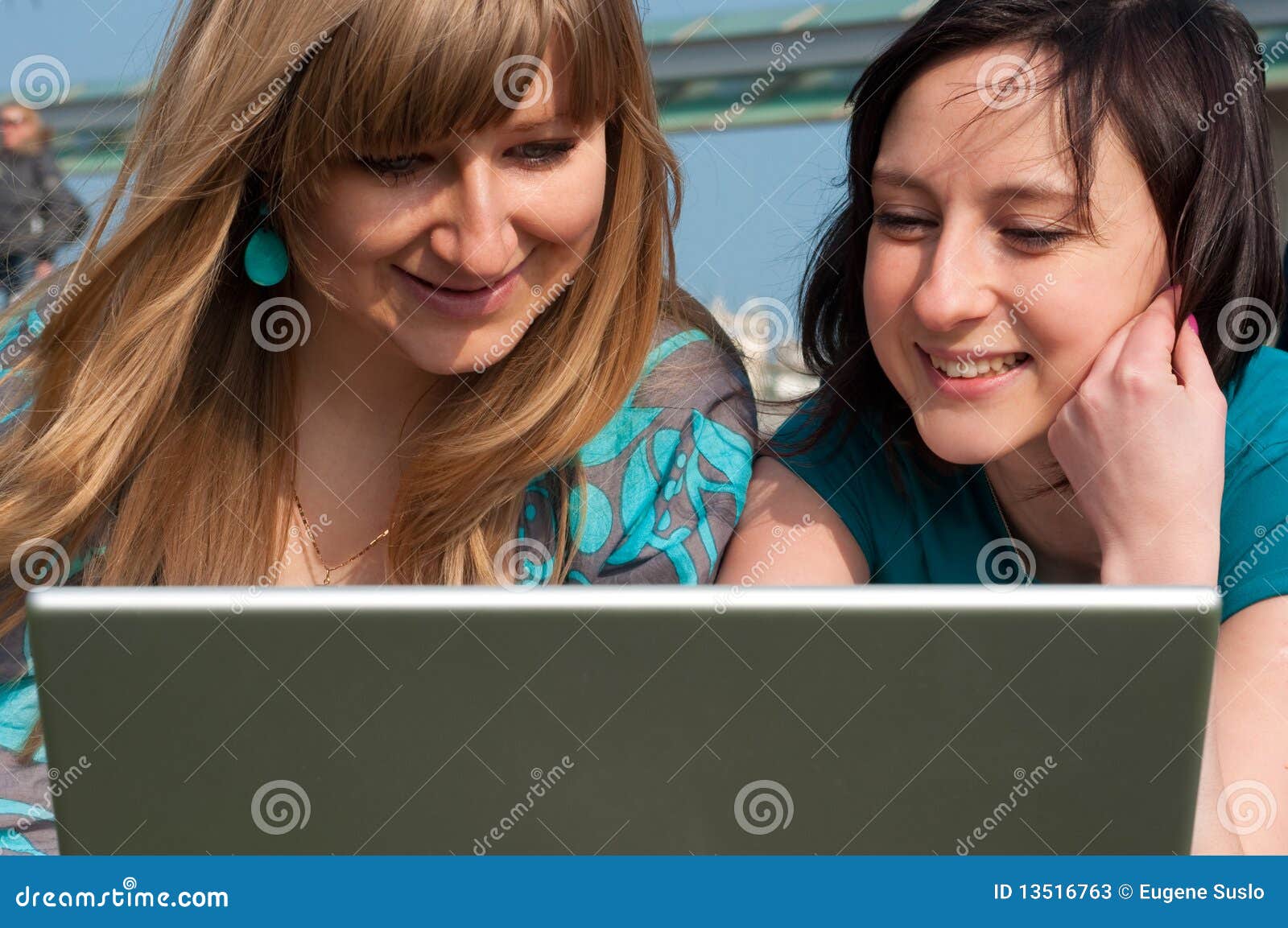Two girls with a laptop stock image. Image of computer - 13516763