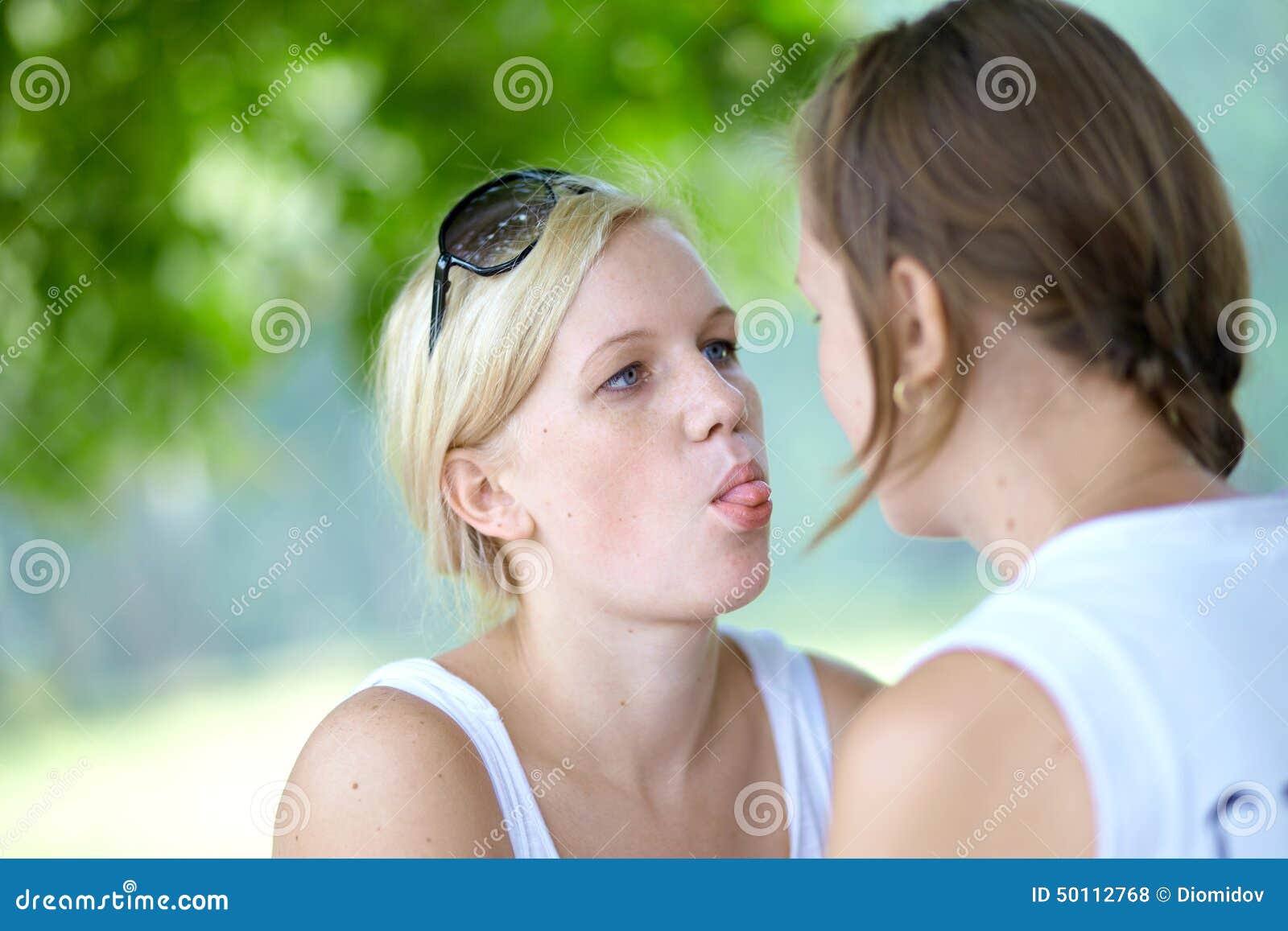 Two Girls Look at Each Other in the Summer Park Stock Photo - Image of ...