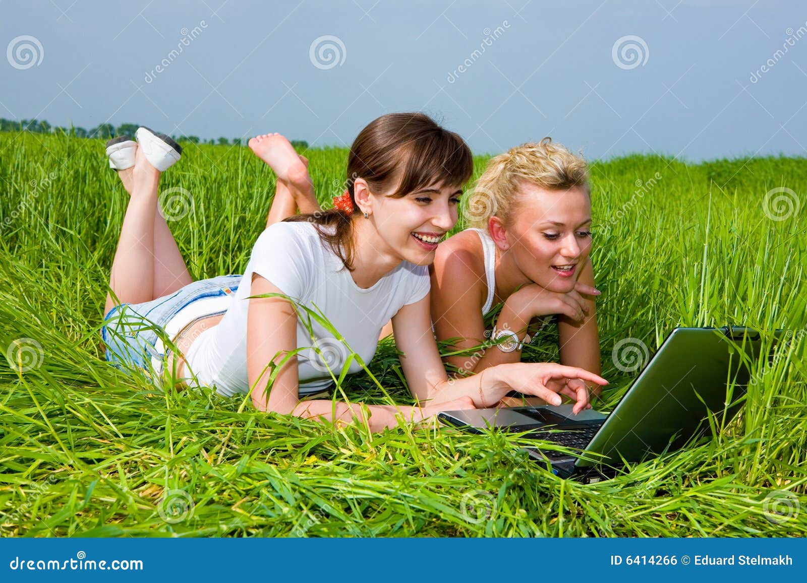 Two Girls Looking at Laptop Computer Stock Photo - Image of relaxed ...