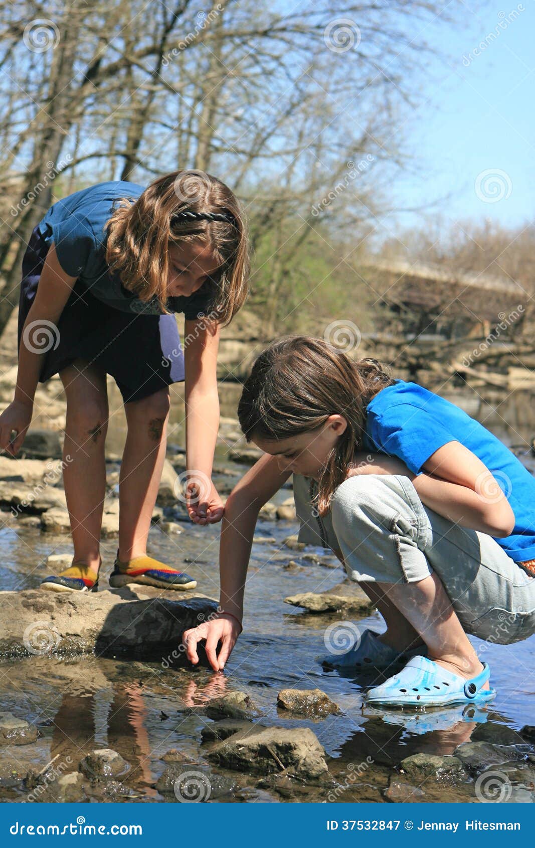 Two Girls Looking in a Stream Editorial Photography - Image of ...