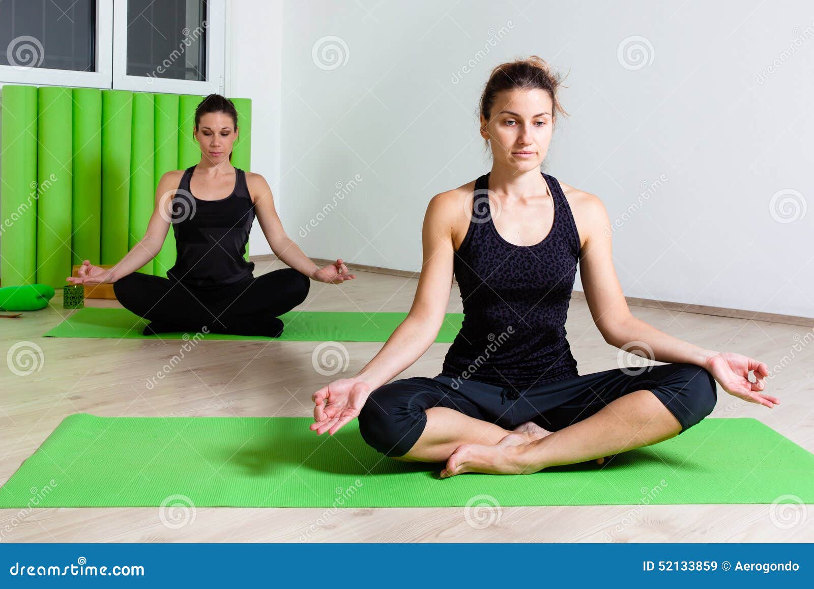 Two Girls in Lotus Position Stock Image - Image of floor, couple: 52133859