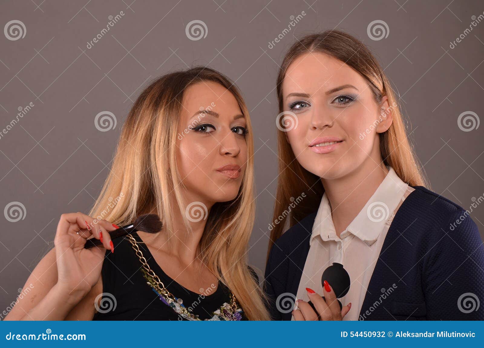 Two girls during makeup stock photo. Image of friends - 54450932