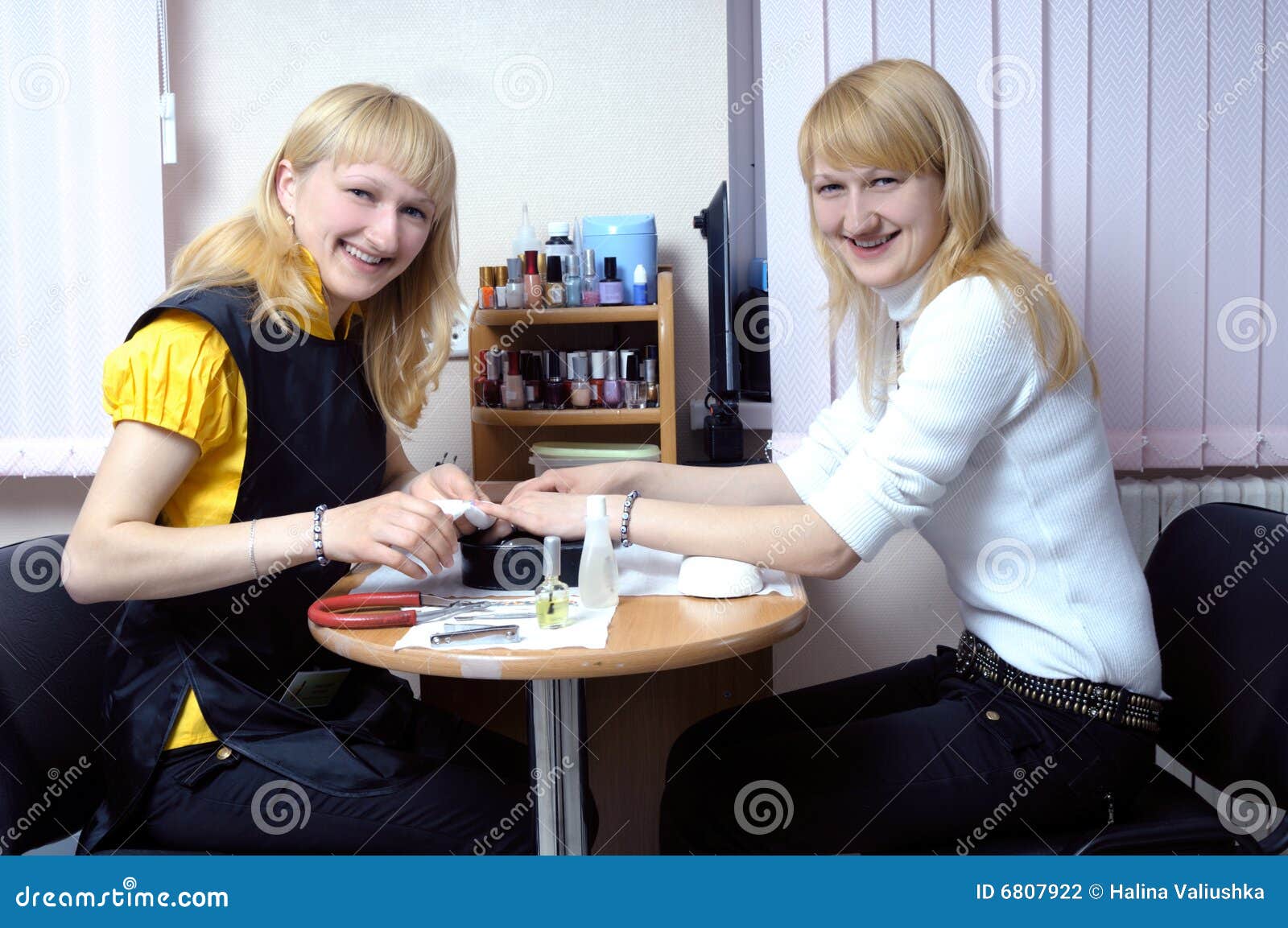 Two girls making manicure stock photo. Image of elegance - 6807922