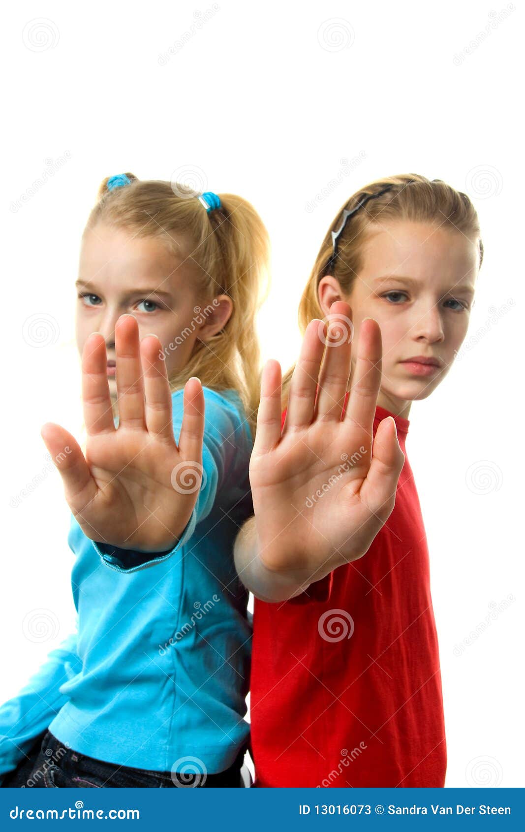 Two girls making stop sign stock image. Image of sign - 13016073