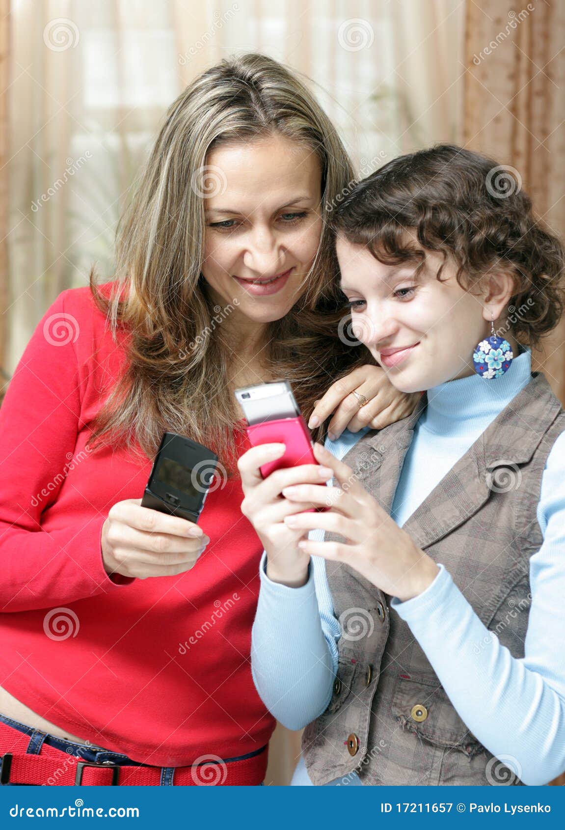 Two Girls with Mobile Phones Stock Image - Image of face, student: 17211657