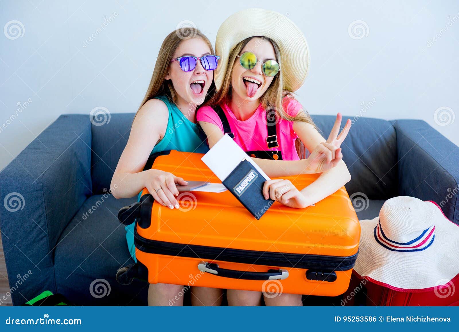 Two Girls Packing Suitcases Stock Photo - Image of happiness, clothes ...