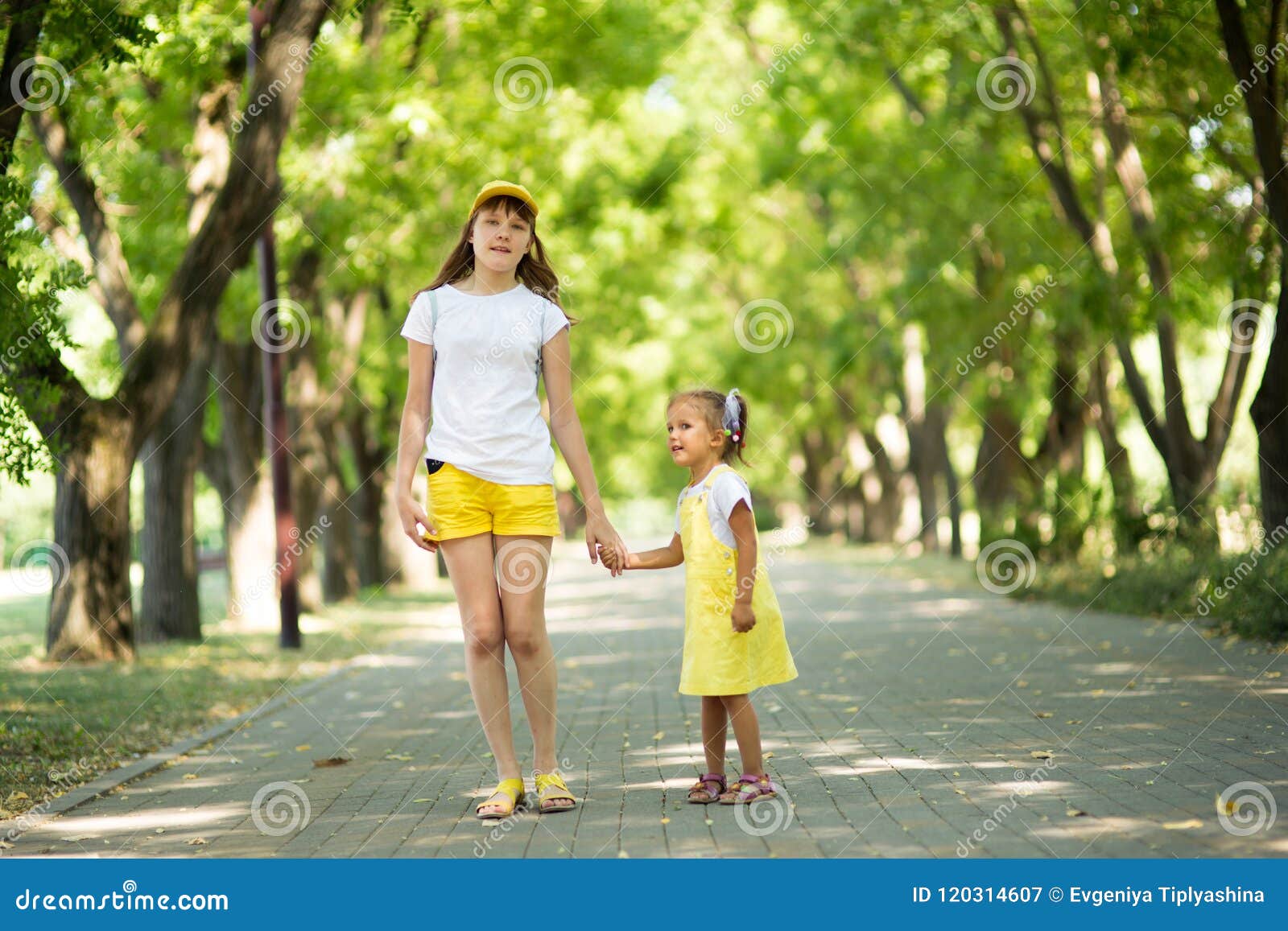 Two girls in the park stock image. Image of children - 120314607