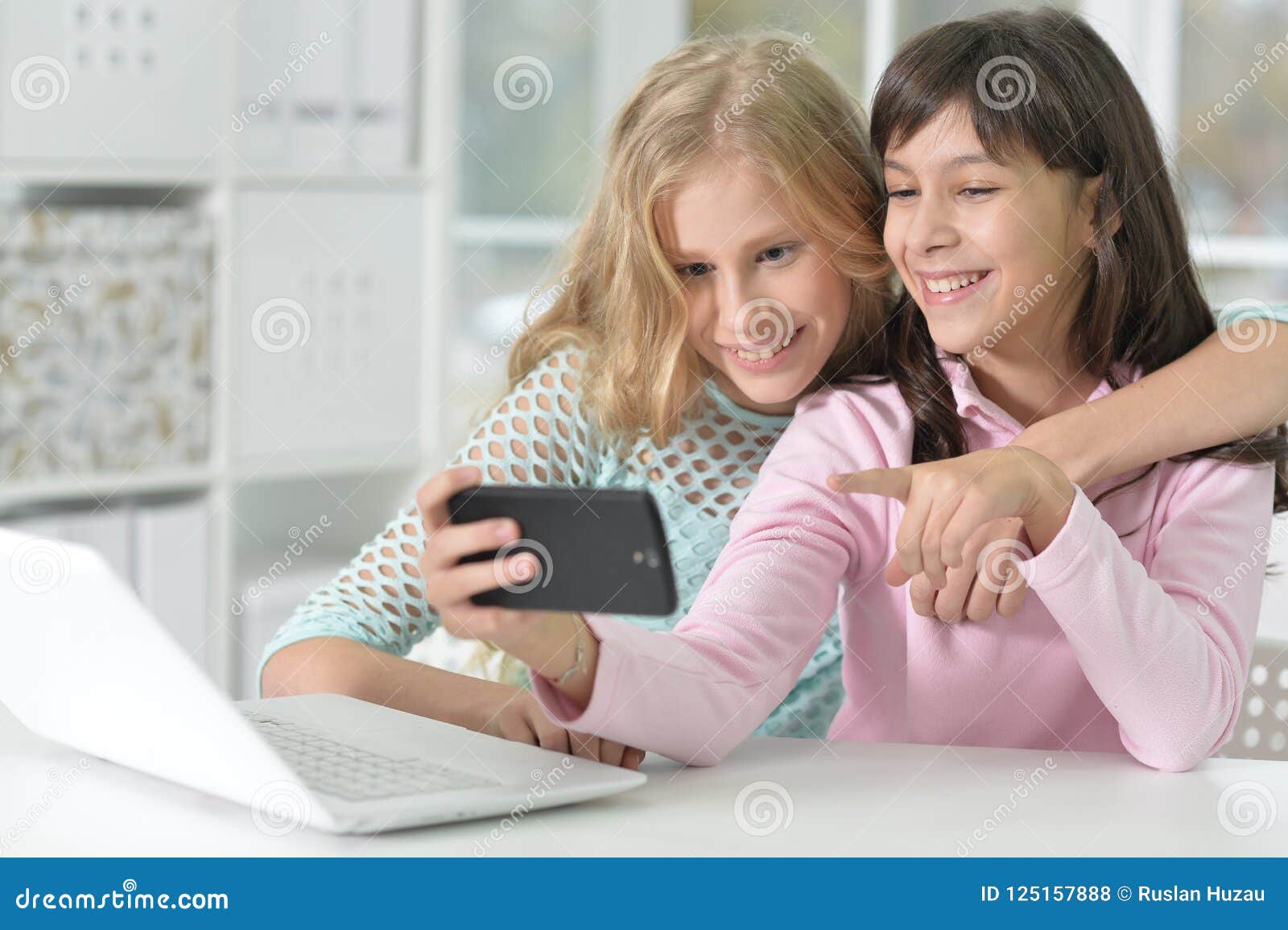 Portrait of Two Girls with Phone and Laptop Stock Photo - Image of ...