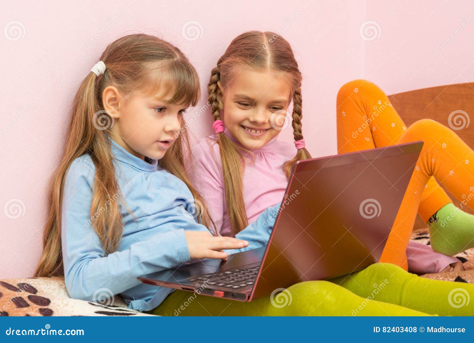 Two Girls Play Computer Games on Laptop Stock Photo - Image of pastime ...