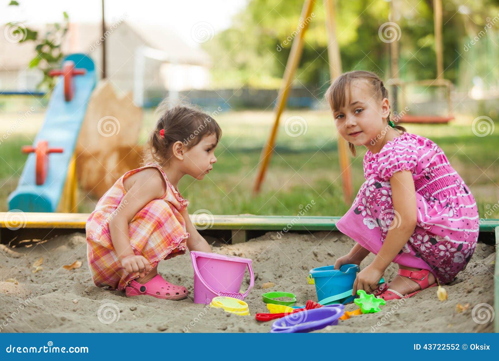 Two Girls Play in the Sandbox Stock Photo - Image of plastic, childhood ...