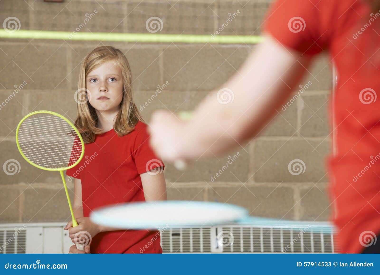 Two Girls Playing Badminton in School Gym Stock Image - Image of ...