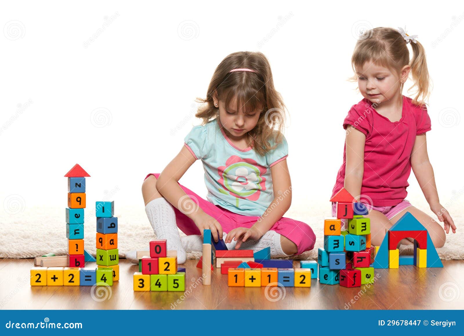 Two Girls are Playing on the Floor Stock Image - Image of friendship ...