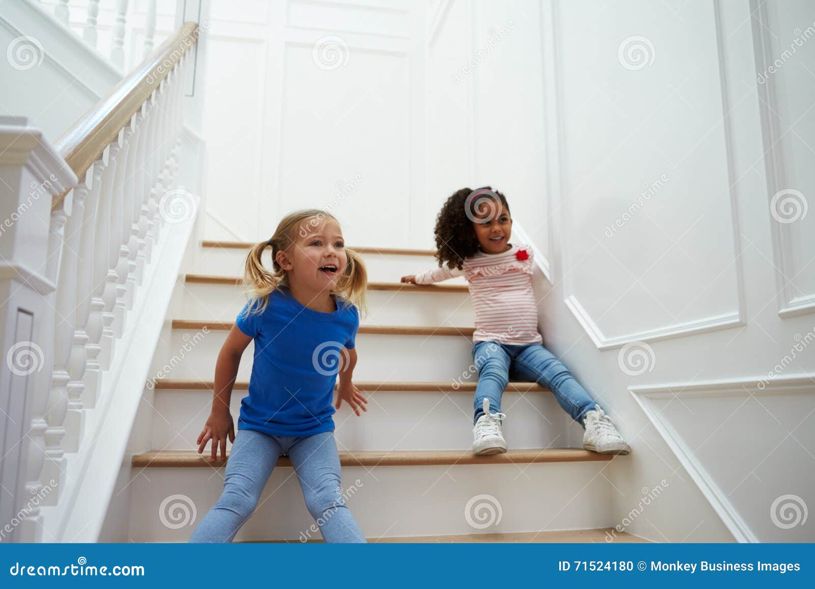 Two Girls Playing Game on Staircase at Home Stock Photo - Image of ...