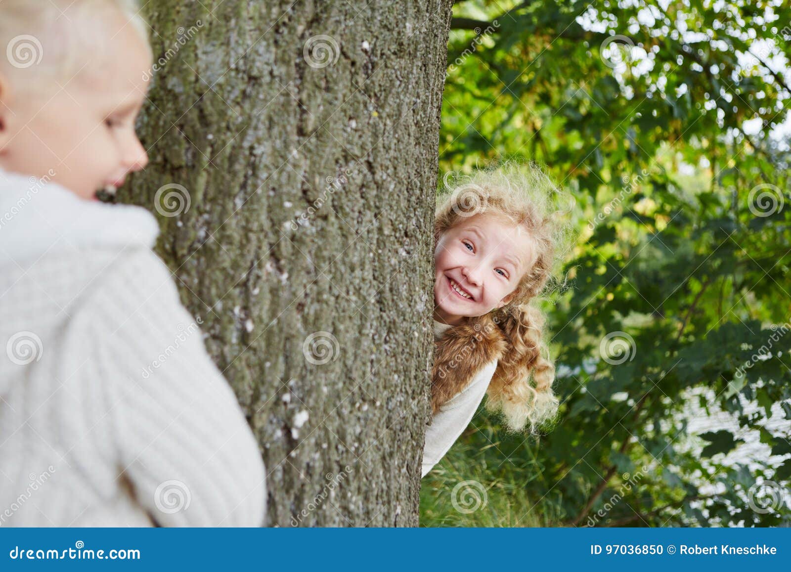 Two Girls Playing Hide and Seek Stock Photo - Image of kids, autumn ...