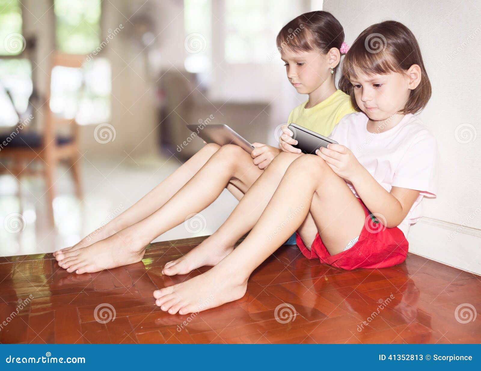 Two Girls Playing on Tablet and Phone Stock Image - Image of internet ...