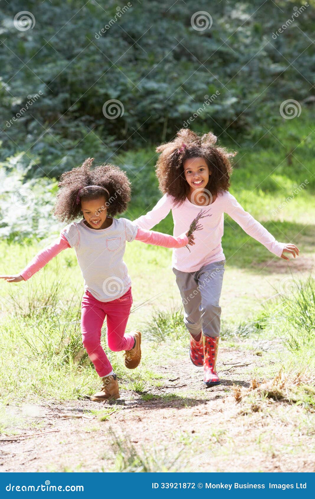 Two Girls Playing in Woods Together Stock Photo - Image of happy ...