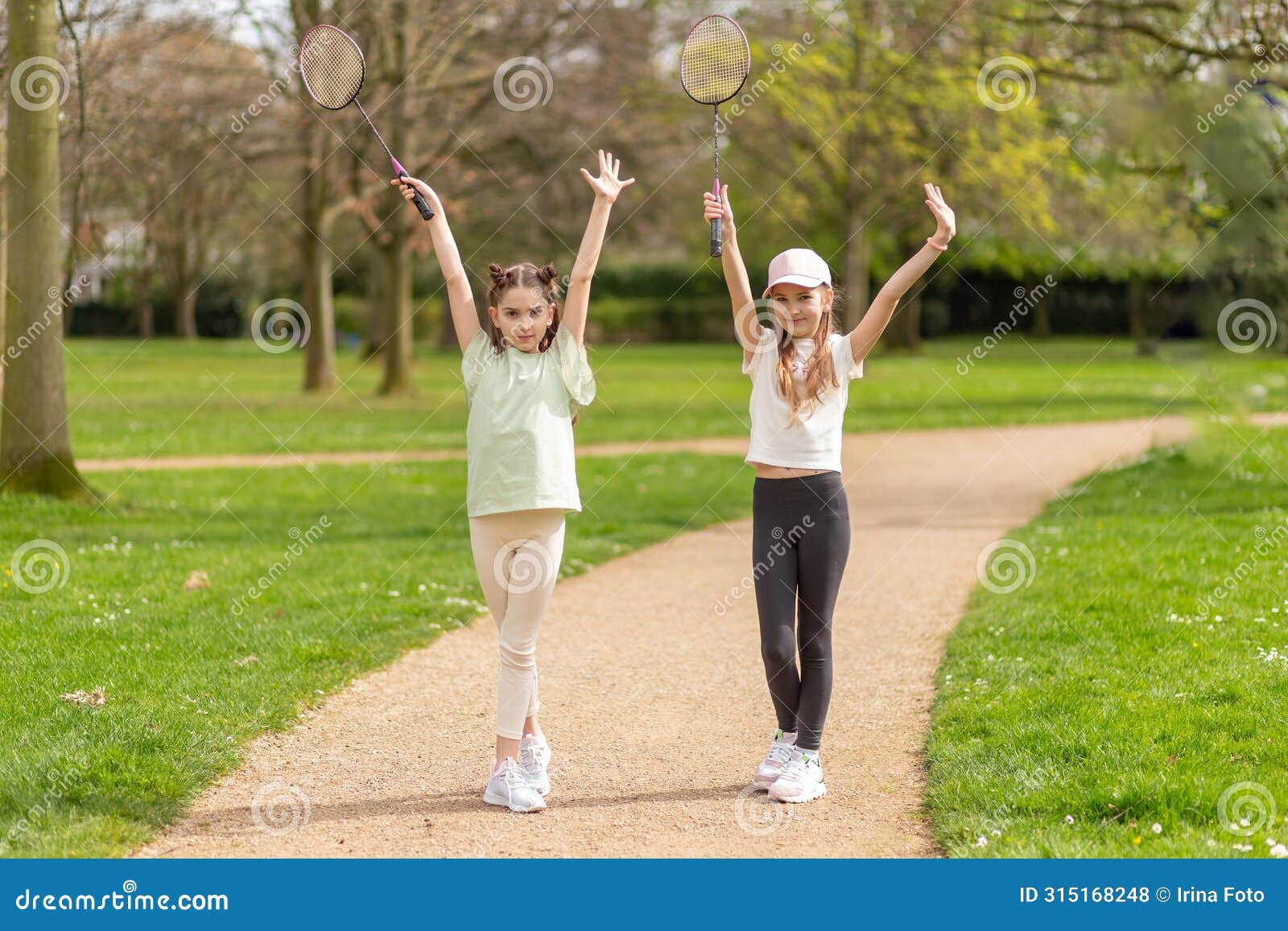 Two Girls Posing with Badminton Rackets in the Park Stock Photo - Image ...