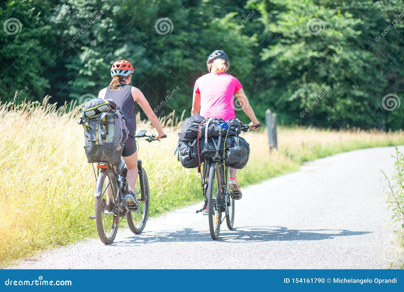Two Girls Practice Cycling on a Bike Path Stock Photo - Image of ...