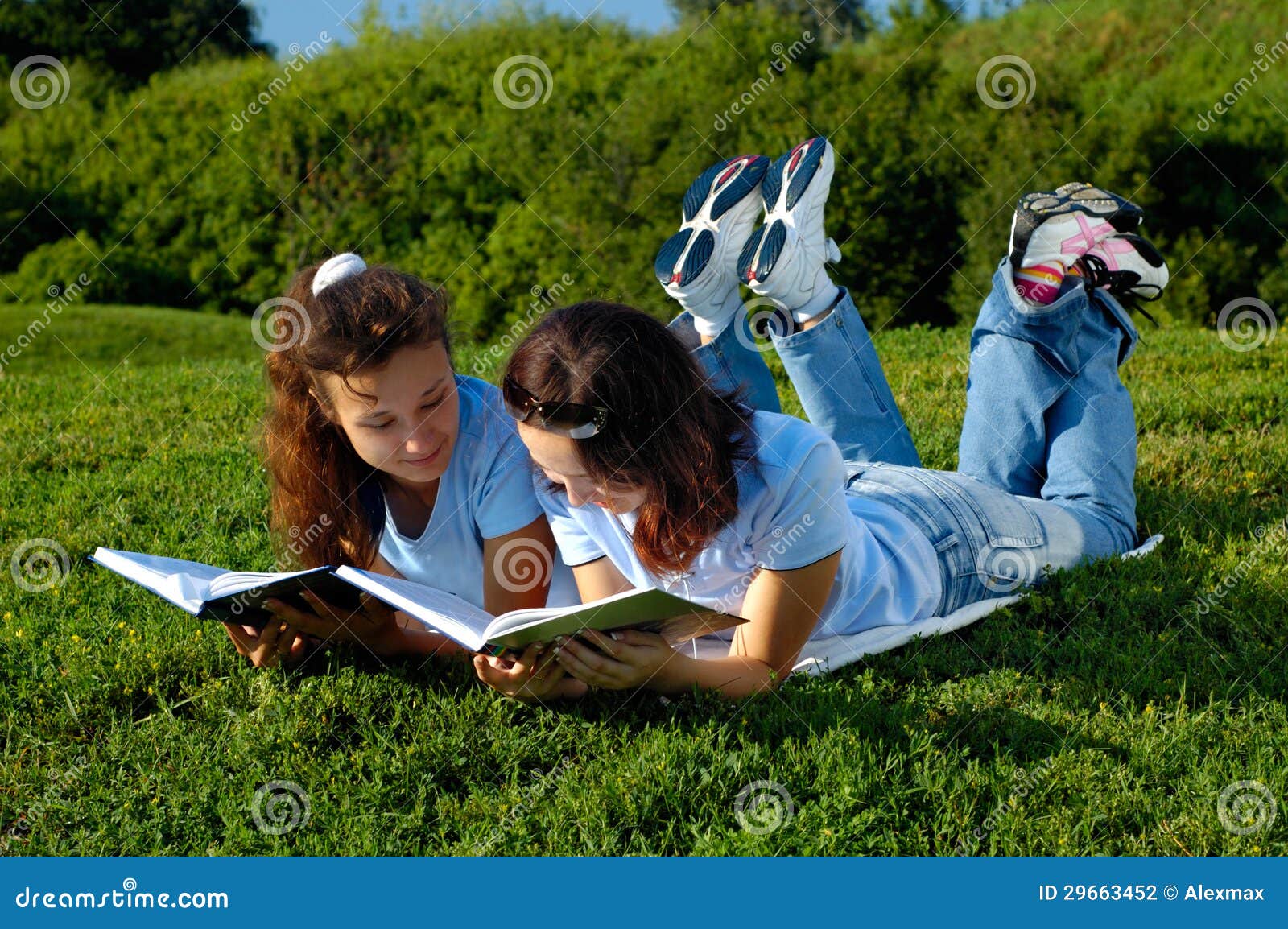 Two Girls Reading Books Outside in a Park Stock Photo - Image of clear ...