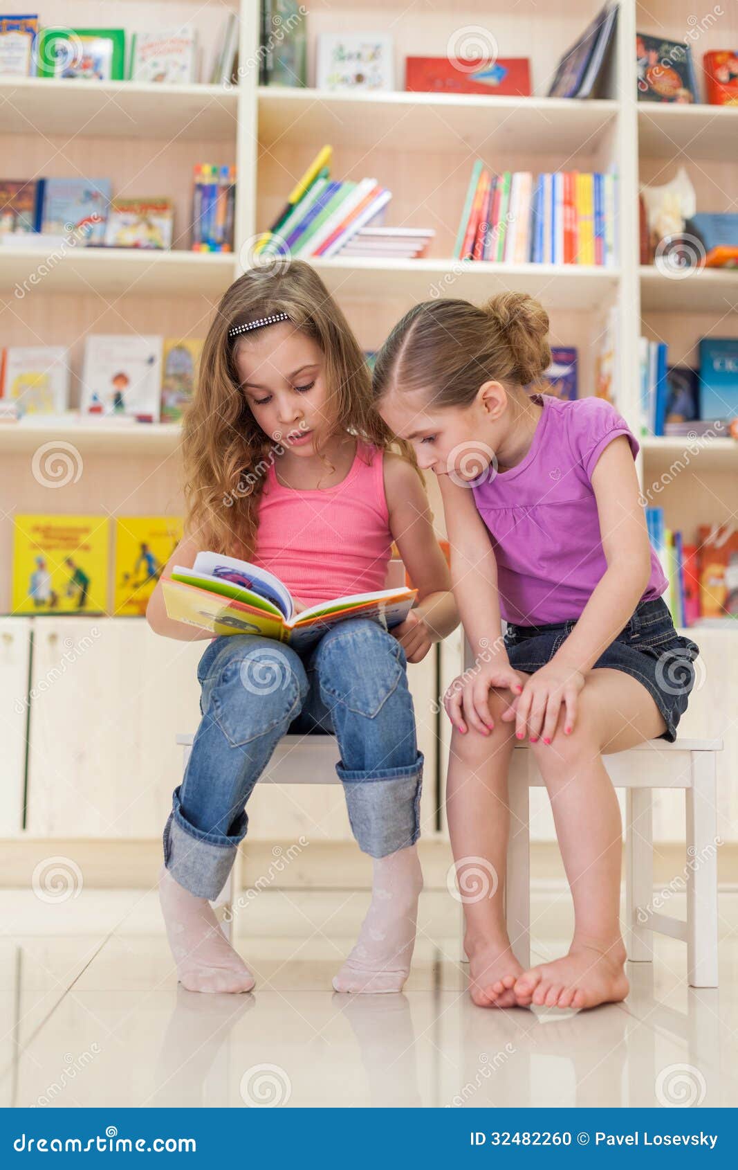 Two Girls Reading a Fascinating Book Stock Photo - Image of education ...
