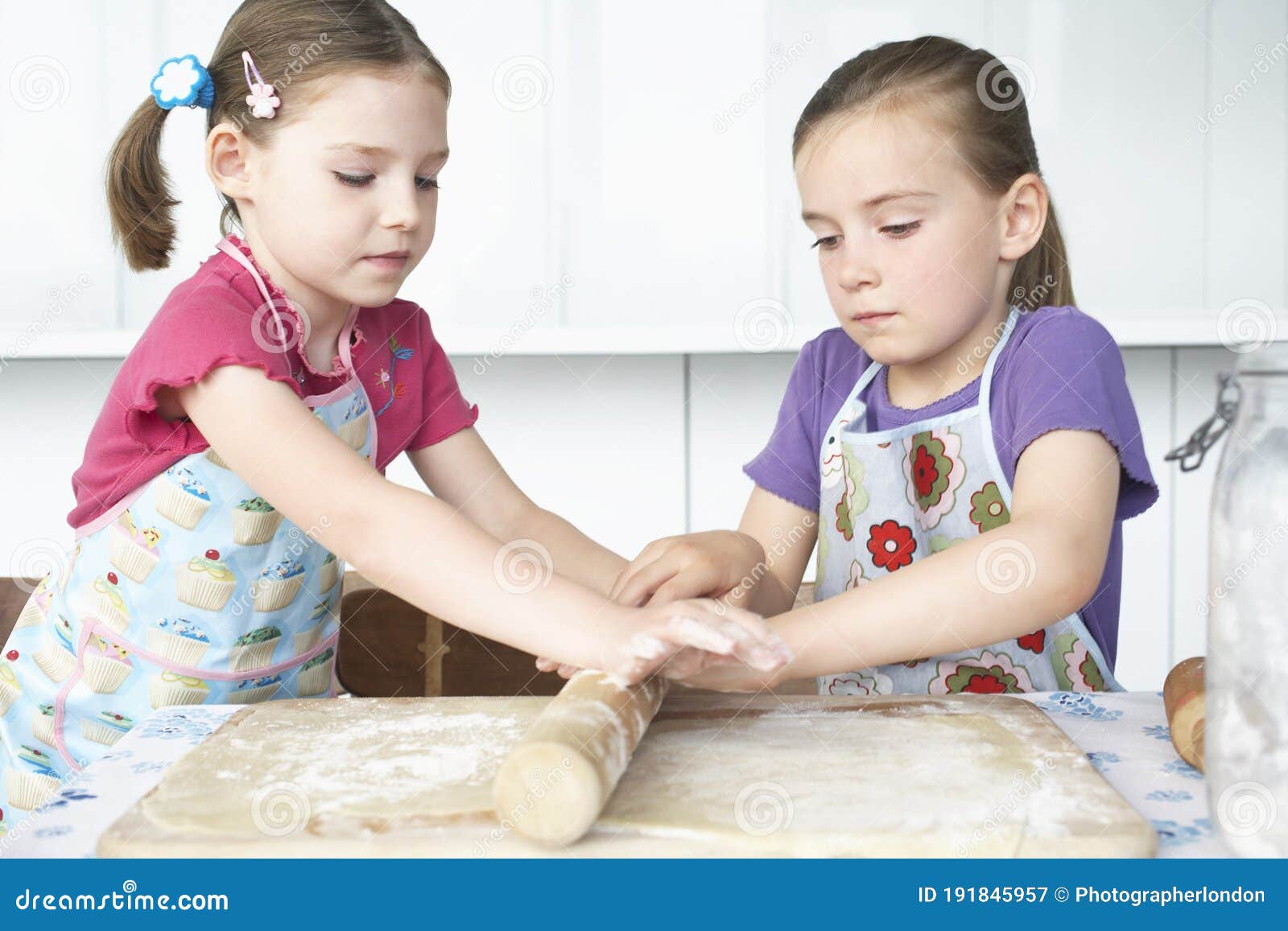 Two Girls (5-6) Cutting Dough in Kitchen Stock Image - Image of dough ...