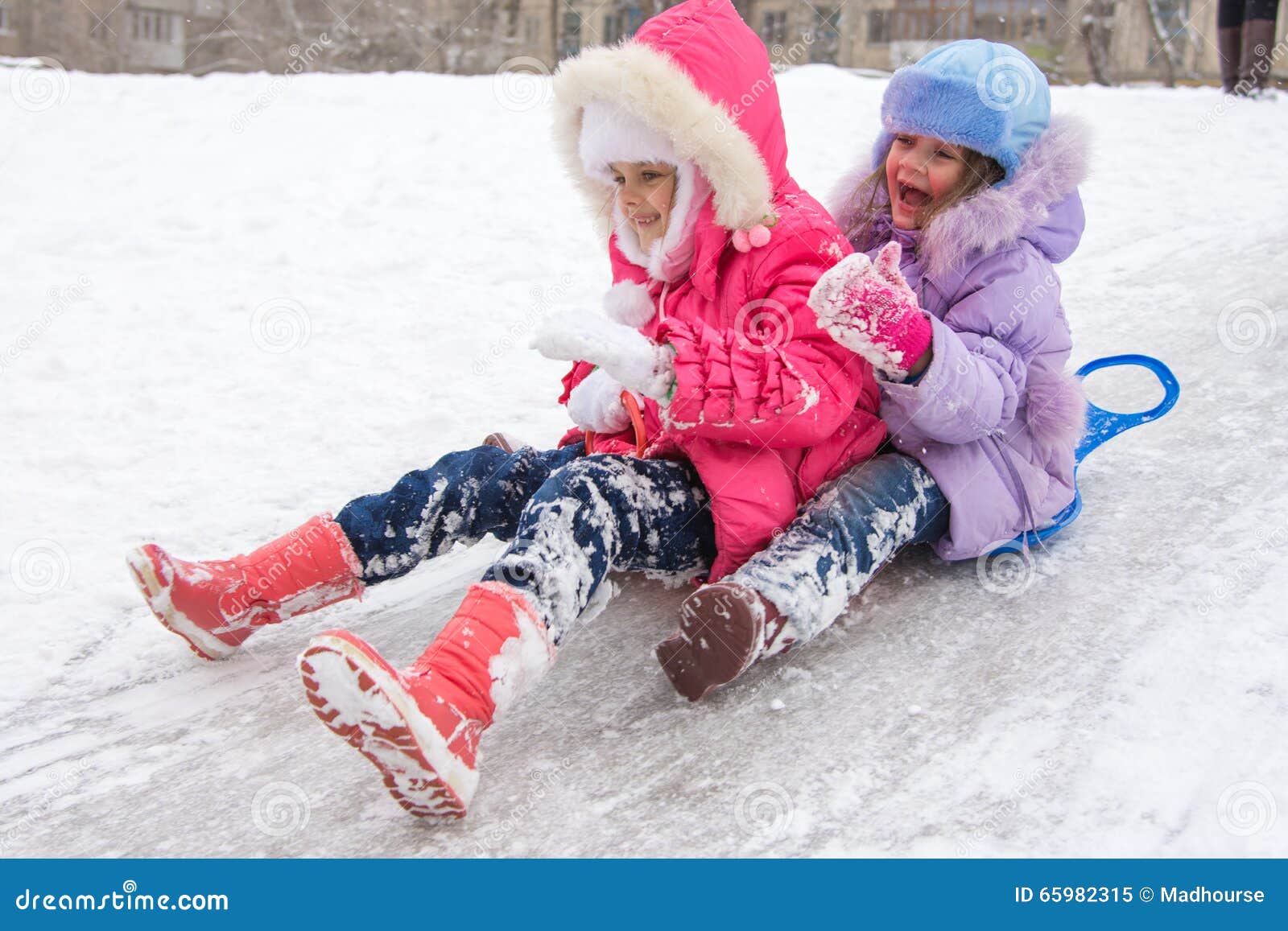 Two Girls Rolling Ice Slides Stock Image - Image of holiday, europeans ...