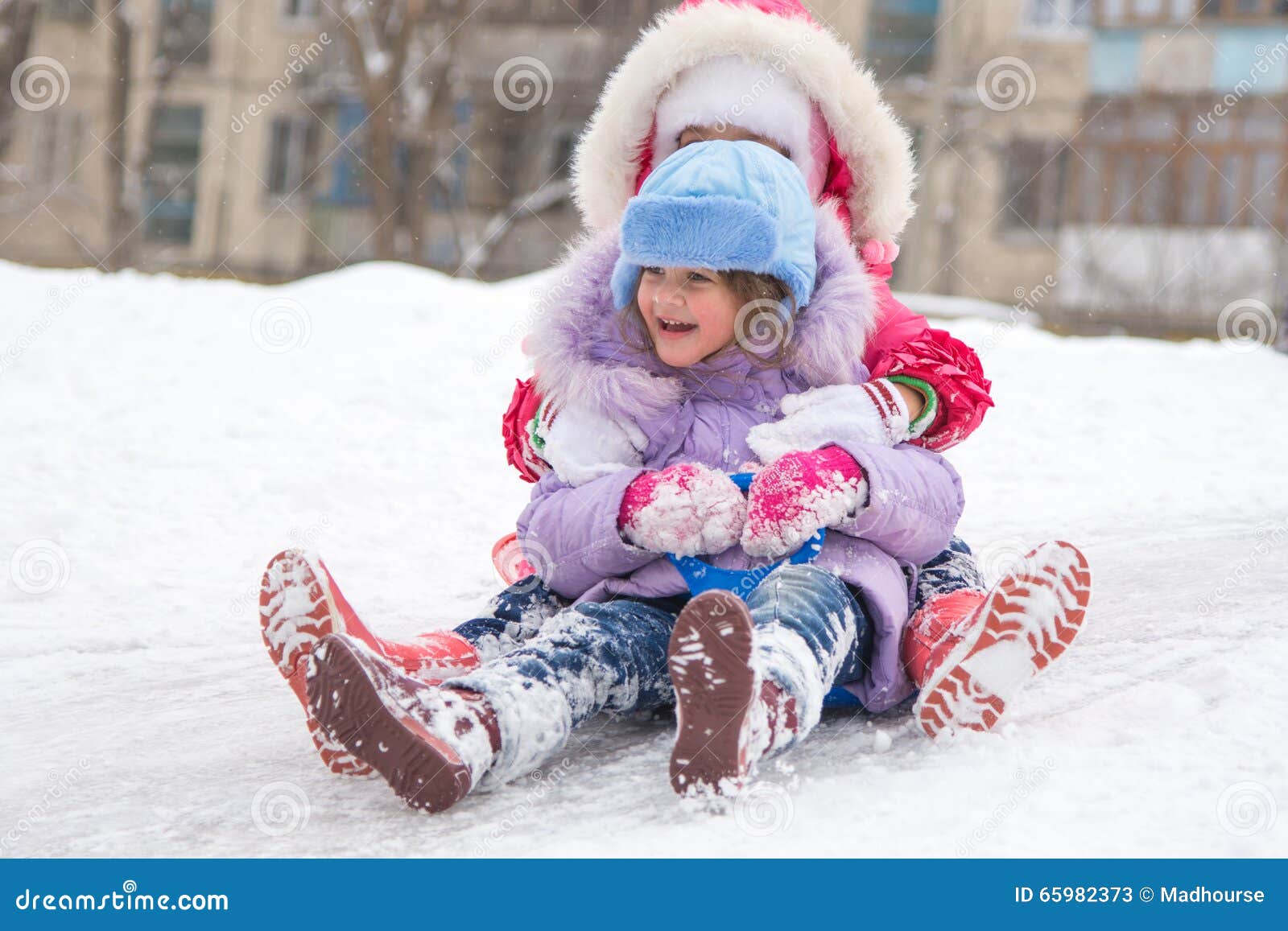 Two Girls Rolling Ice Slides Stock Image - Image of winter, walking ...