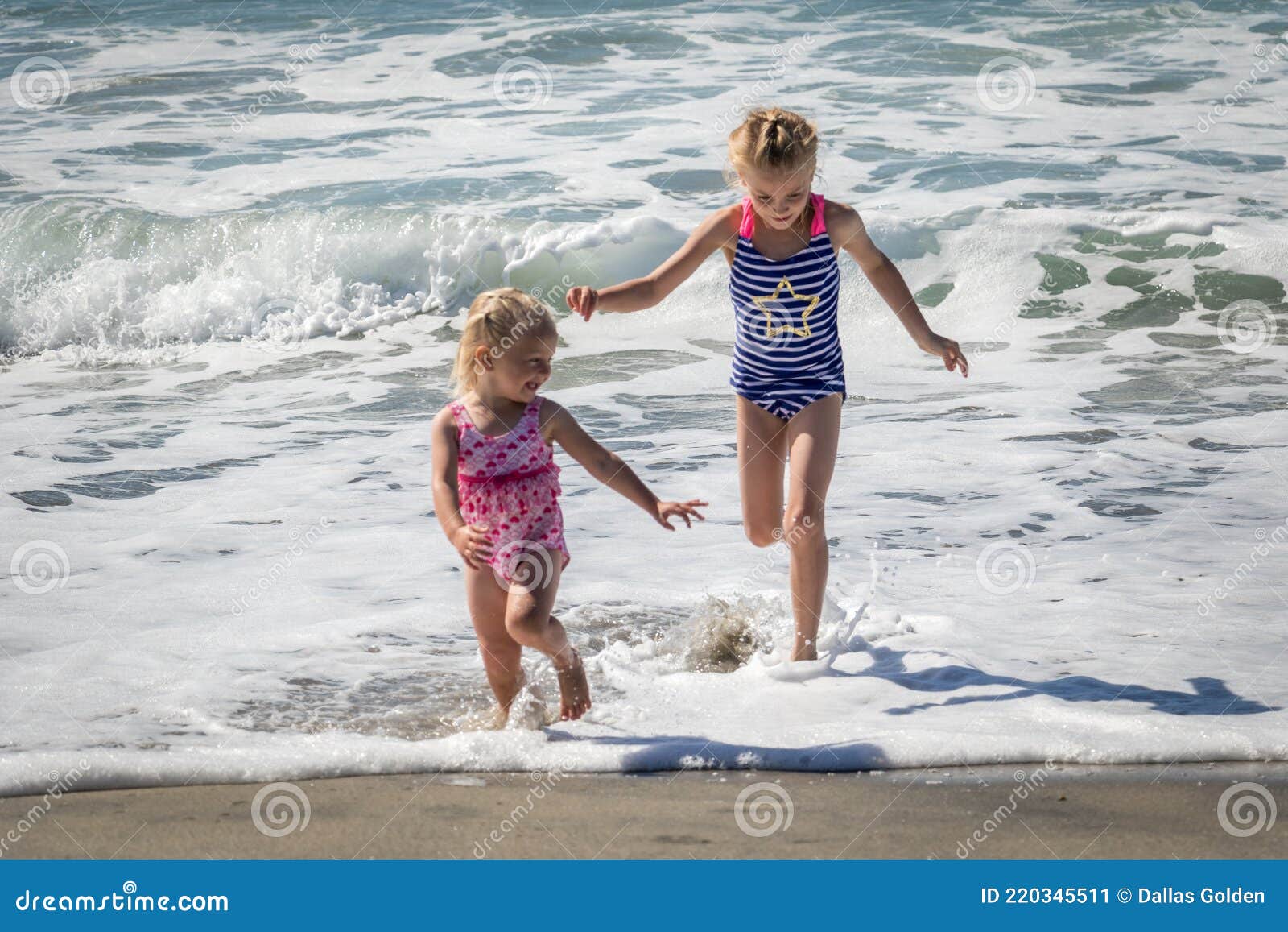 Two Girls Running Away from Ocean Waves Stock Image - Image of water ...