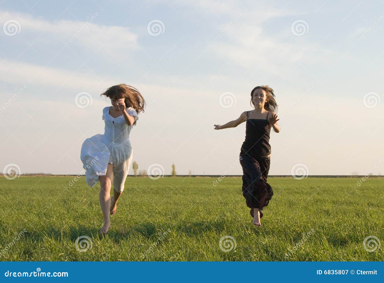 Two Girls Running on the Field 2 Stock Image - Image of girl, adult ...