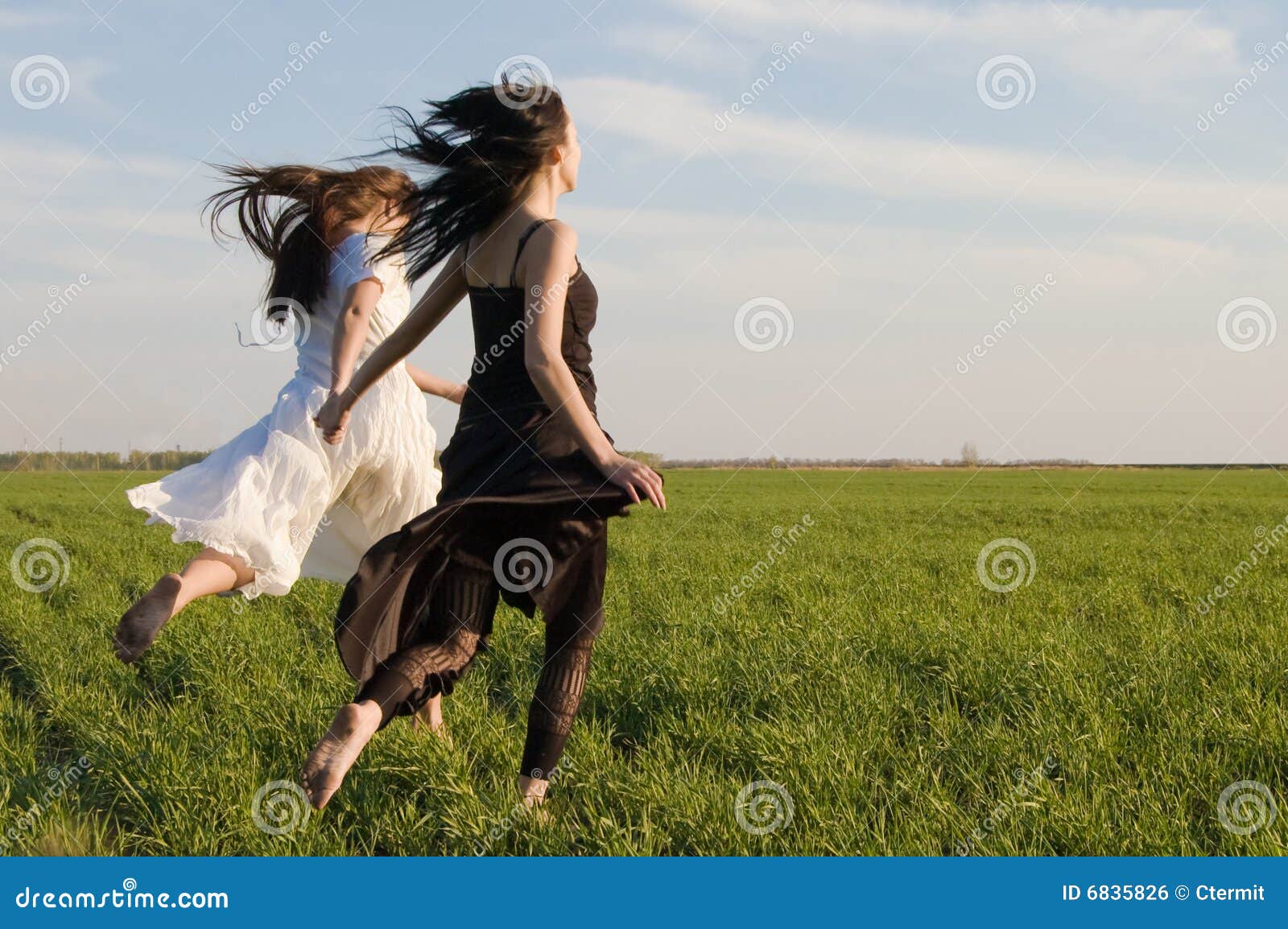 Two Girls Running on the Field 3 Stock Photo - Image of horizon, human ...