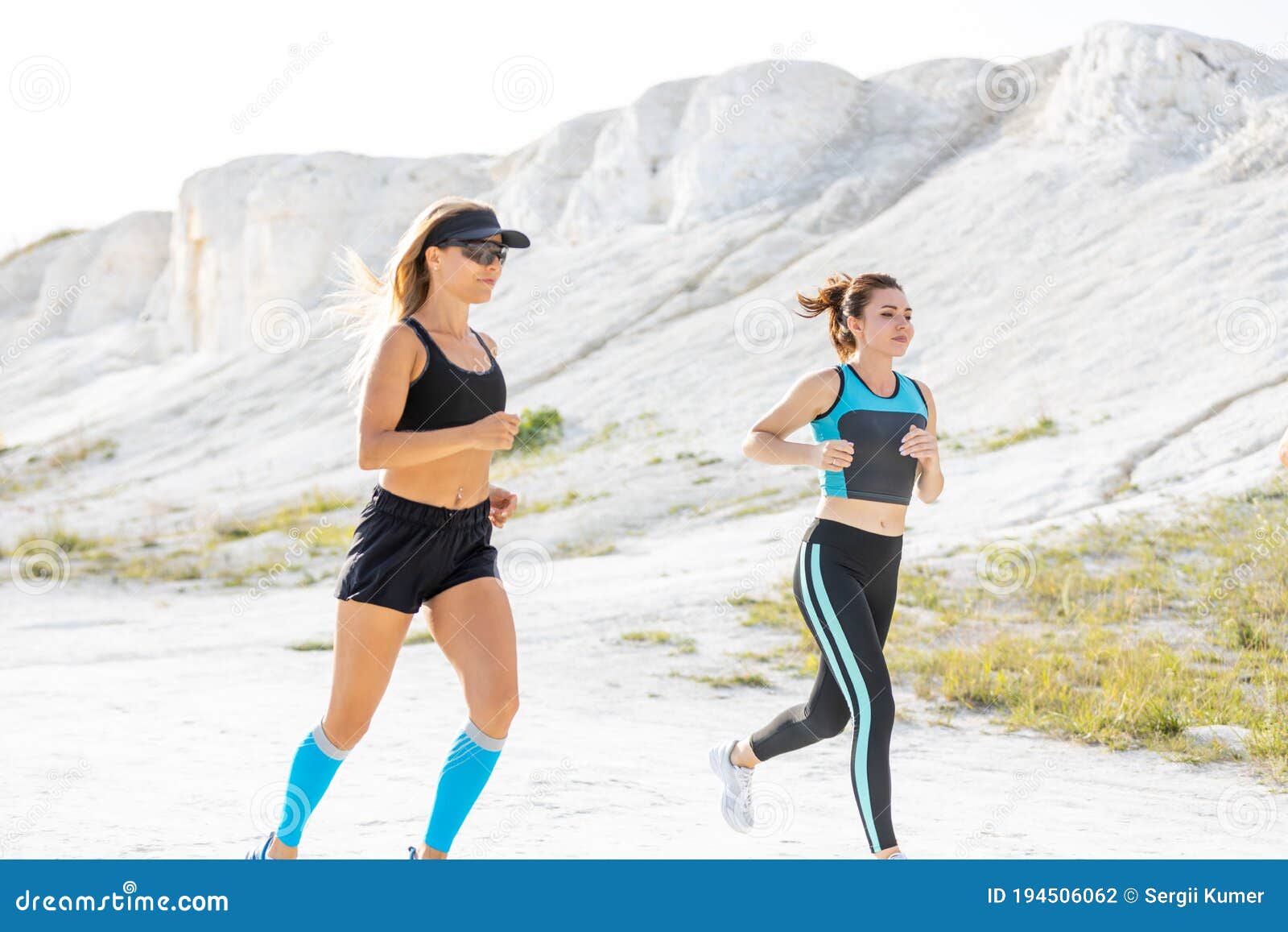 Two Girls Running Outdoors Near the White Cliff Stock Photo - Image of ...