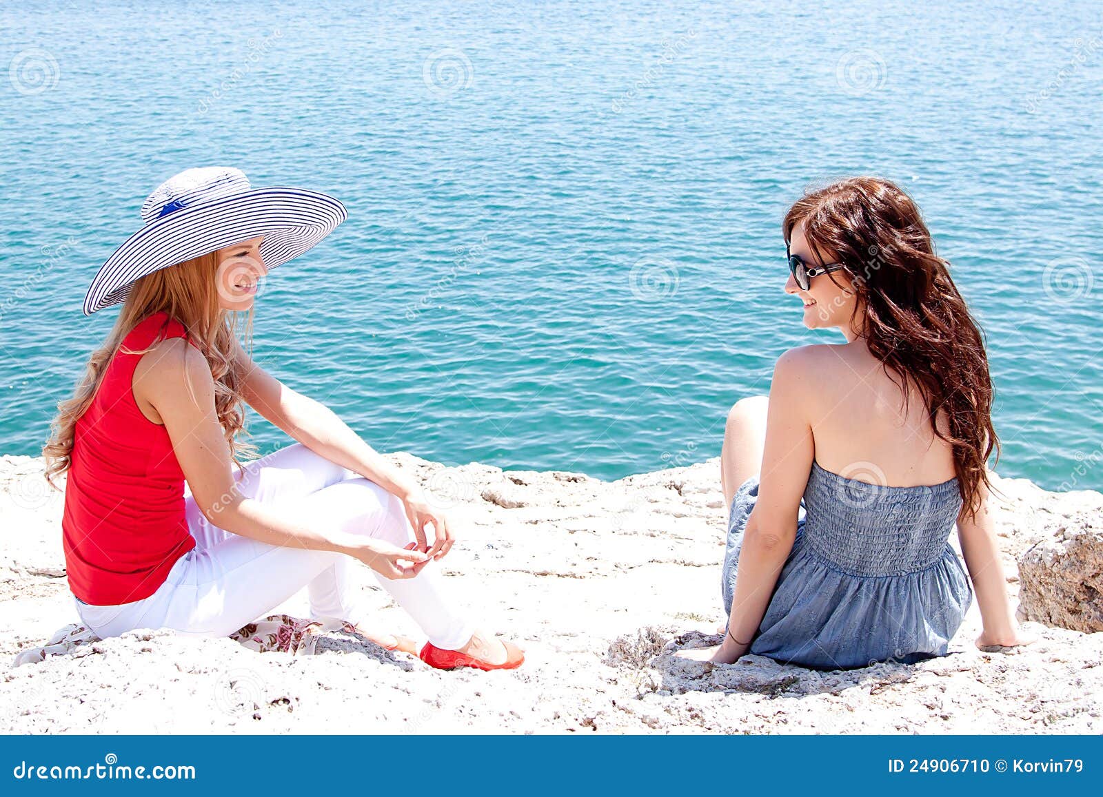 Two girls at the seaside stock photo. Image of hair, elegance - 24906710