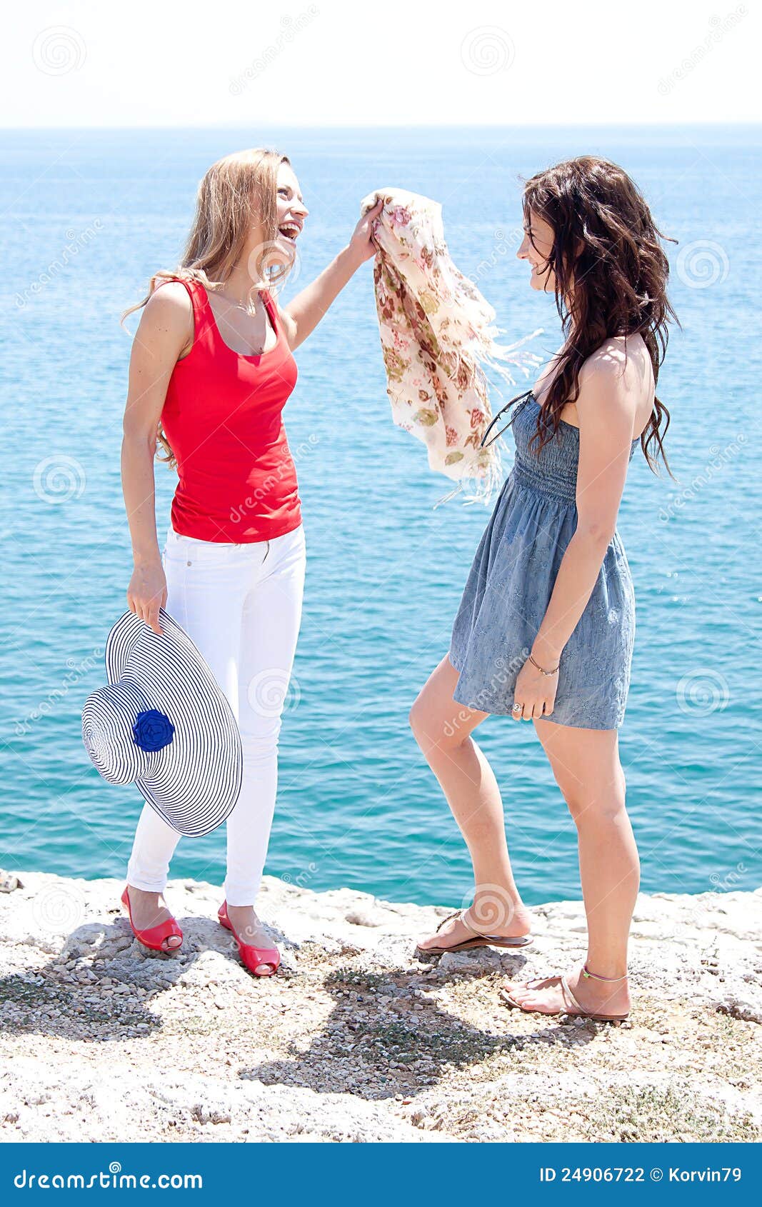 Two girls at the seaside stock photo. Image of casual - 24906722