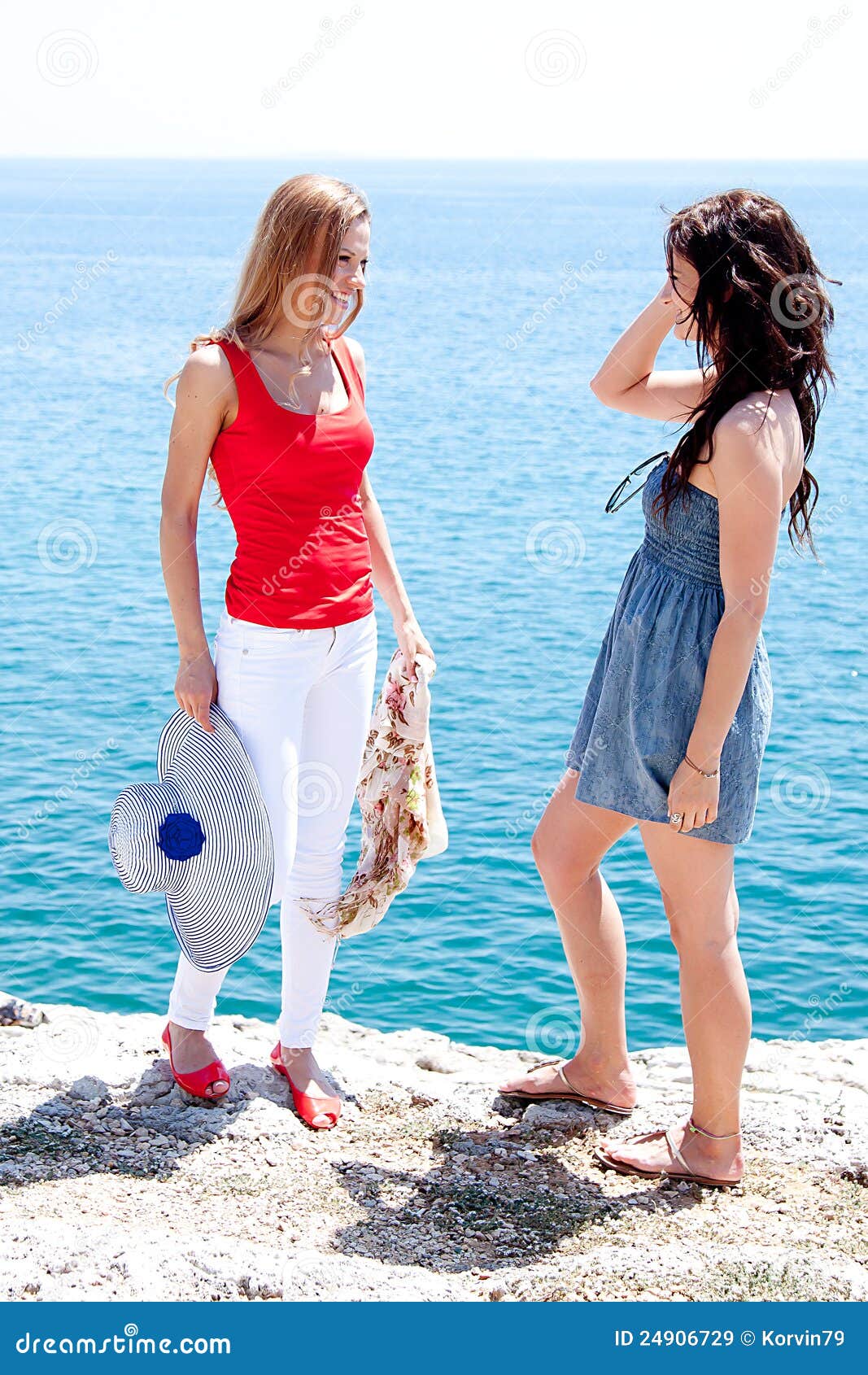 Two girls at the seaside stock image. Image of adult - 24906729