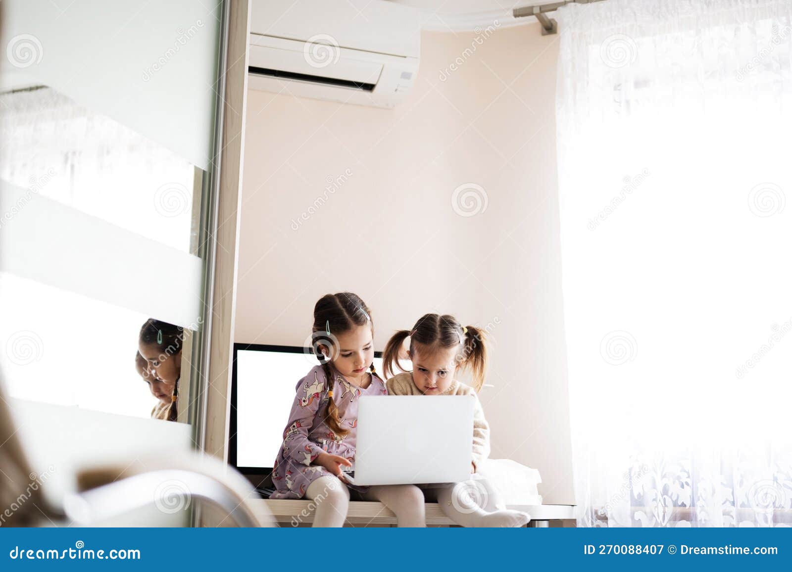 Two Girls Sisters Watching on Laptop. Technology and Home Concept Stock ...