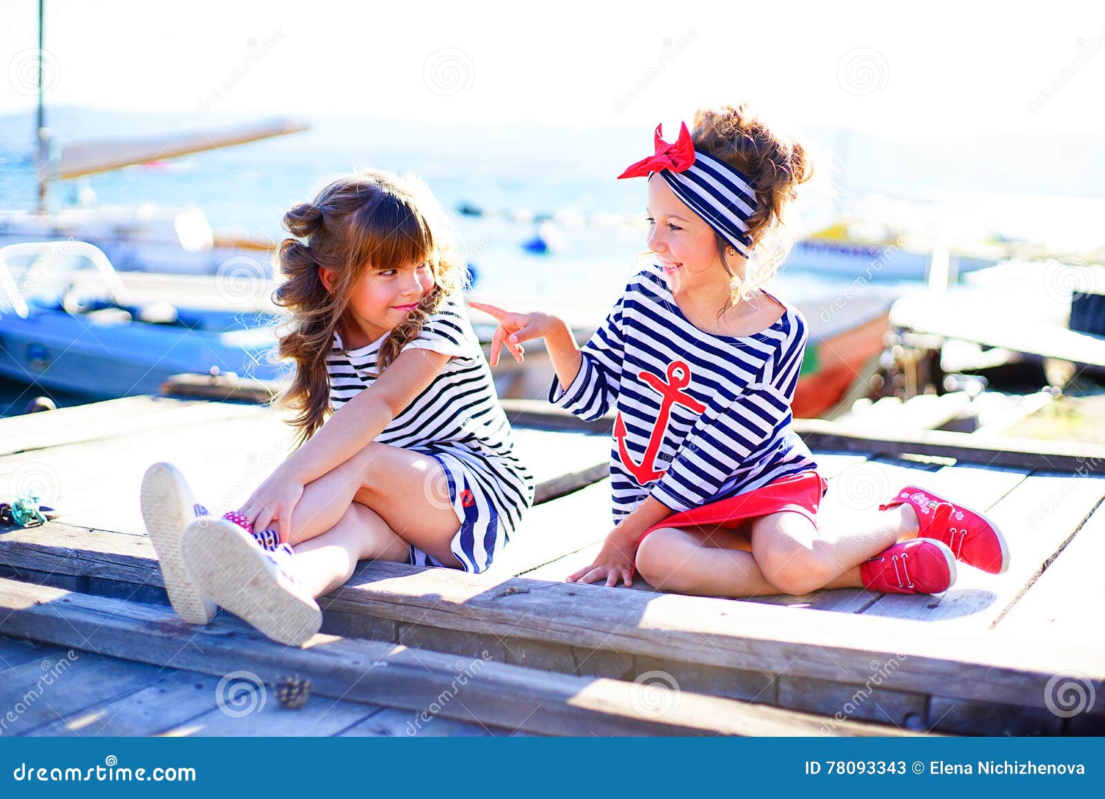 Two Girls Sitting on the Dock Stock Image - Image of happy, laugh: 78093343