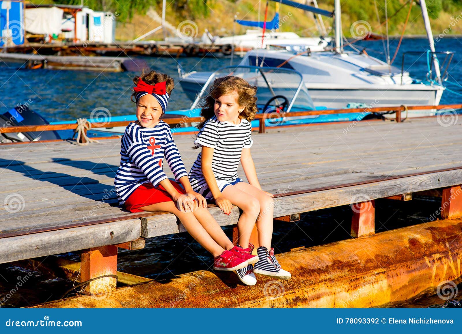 Two Girls Sitting on the Dock Stock Photo - Image of lake, laugh: 78093392