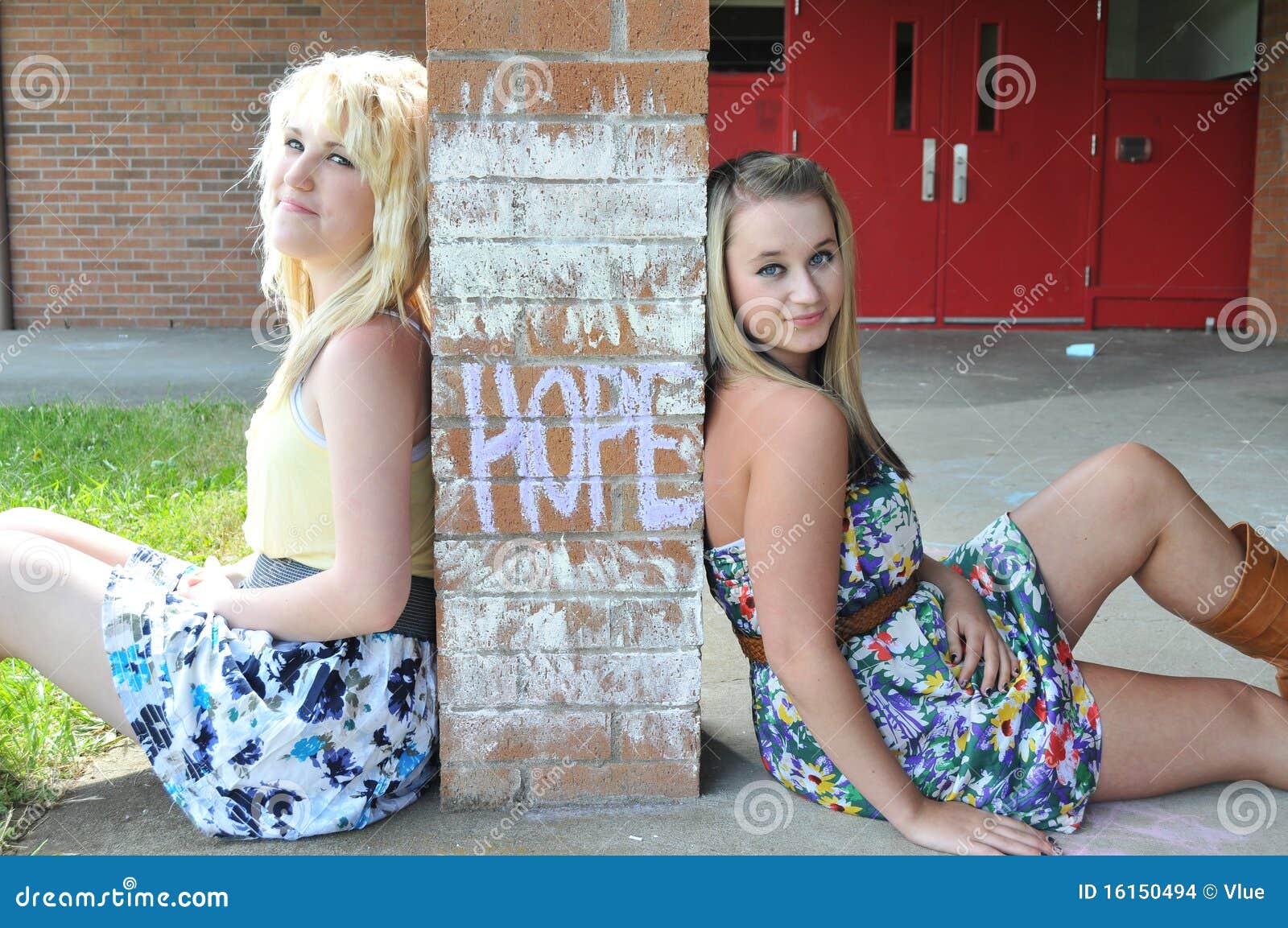 Two Girls Sitting Next To Hope Stock Photo - Image of building, chalk ...