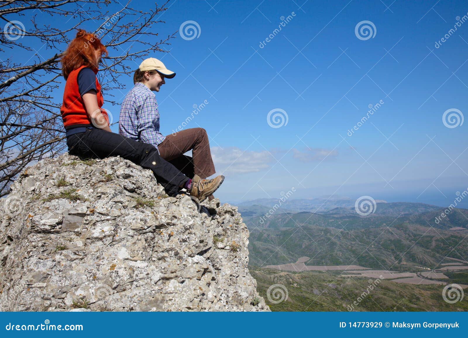Two Girls Sitting on a Rock Stock Image - Image of maker, leisure: 14773929