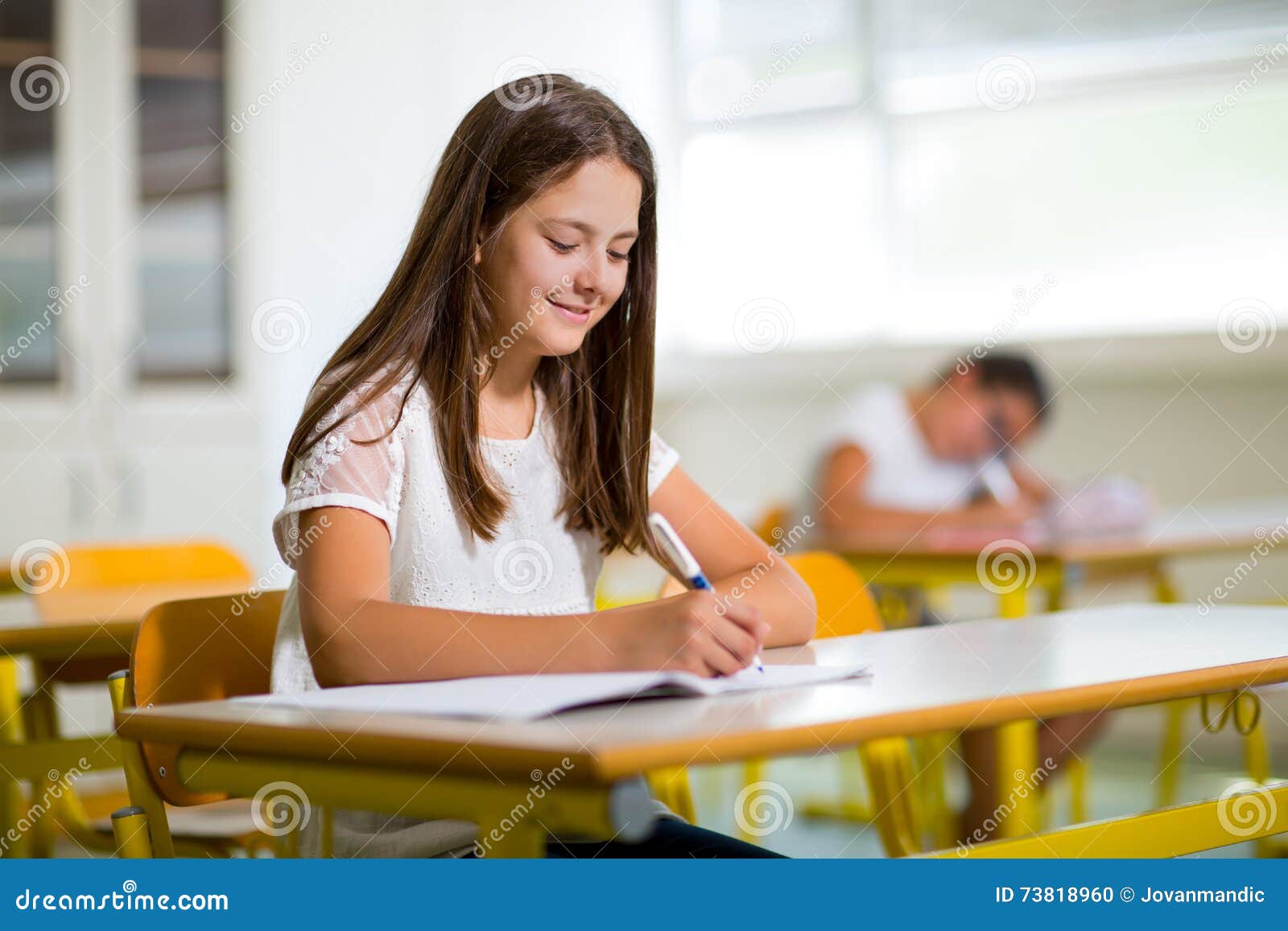 Two Girls Sitting in a School Classroom Stock Photo - Image of happy ...
