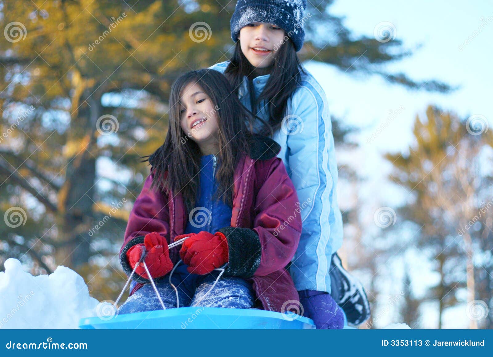 Two girls sledding stock image. Image of fresh, love, hill - 3353113