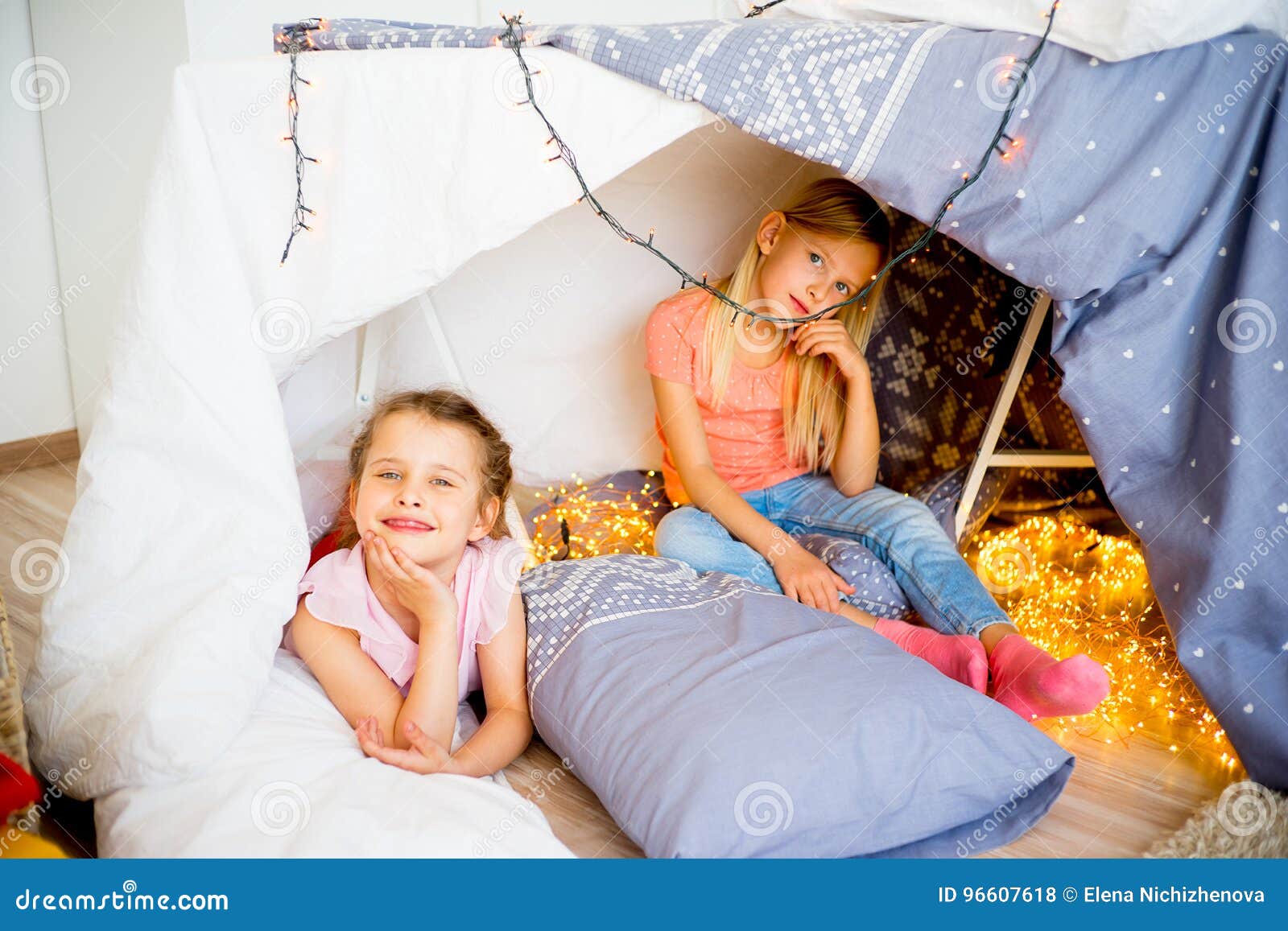 Two girls at a sleepover stock photo. Image of couch - 96607618