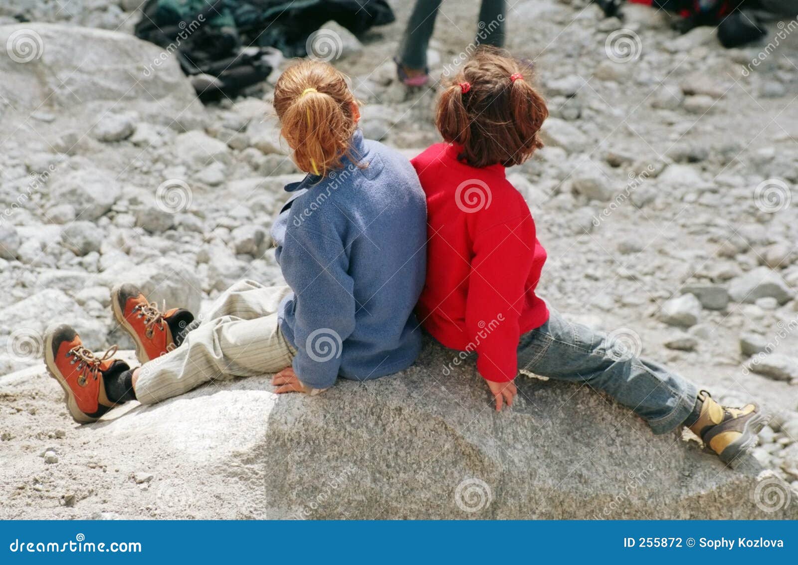 Two girls on a stone stock photo. Image of people, girl - 255872