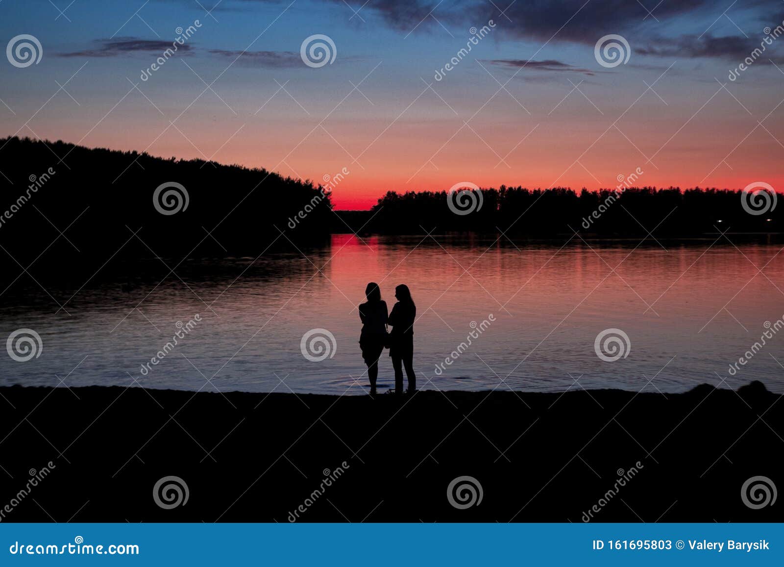 Two girls at sunset stock image. Image of lifestyle - 161695803
