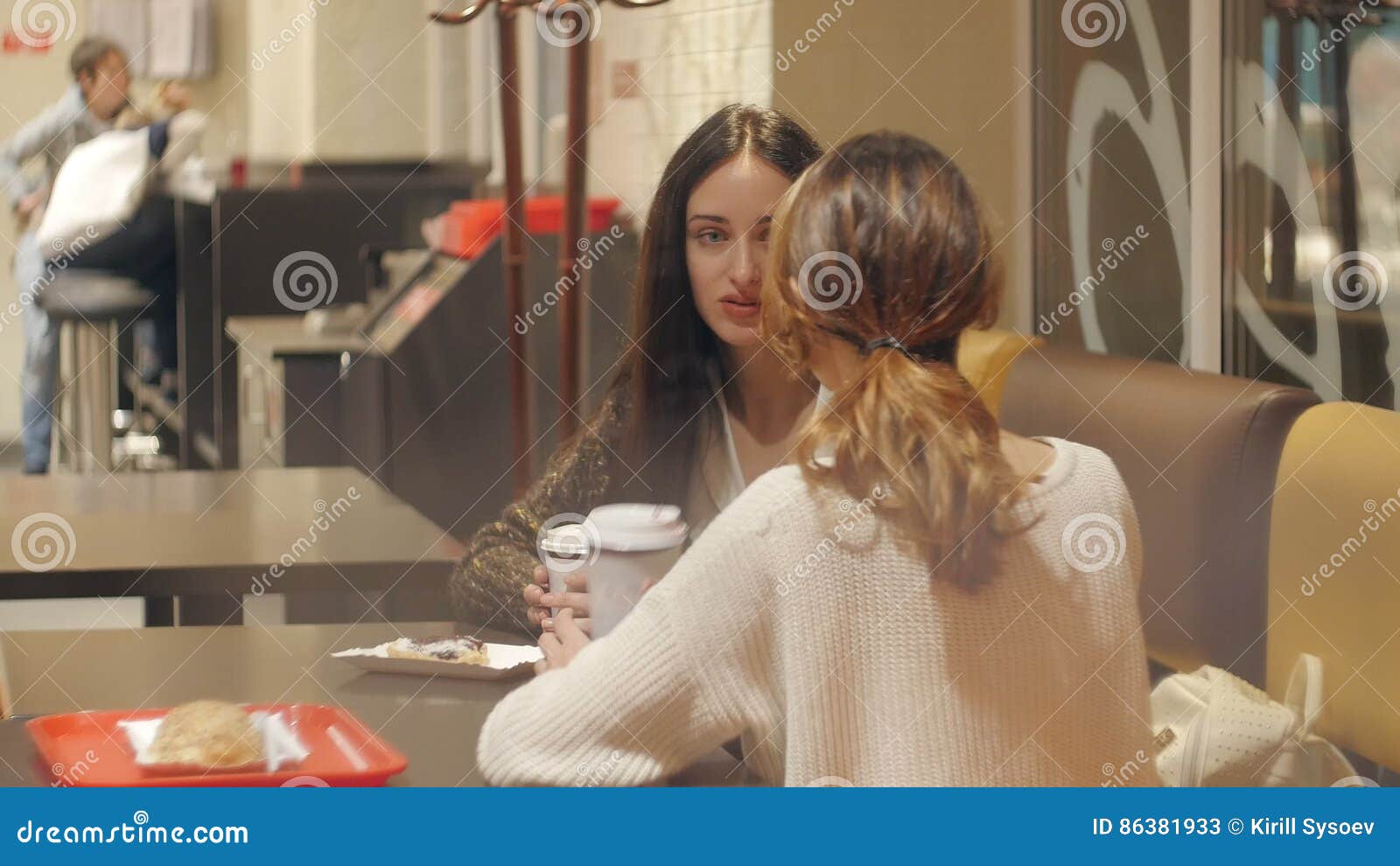 Two Girls are Talking in a Cafe Stock Video - Video of colleagues ...