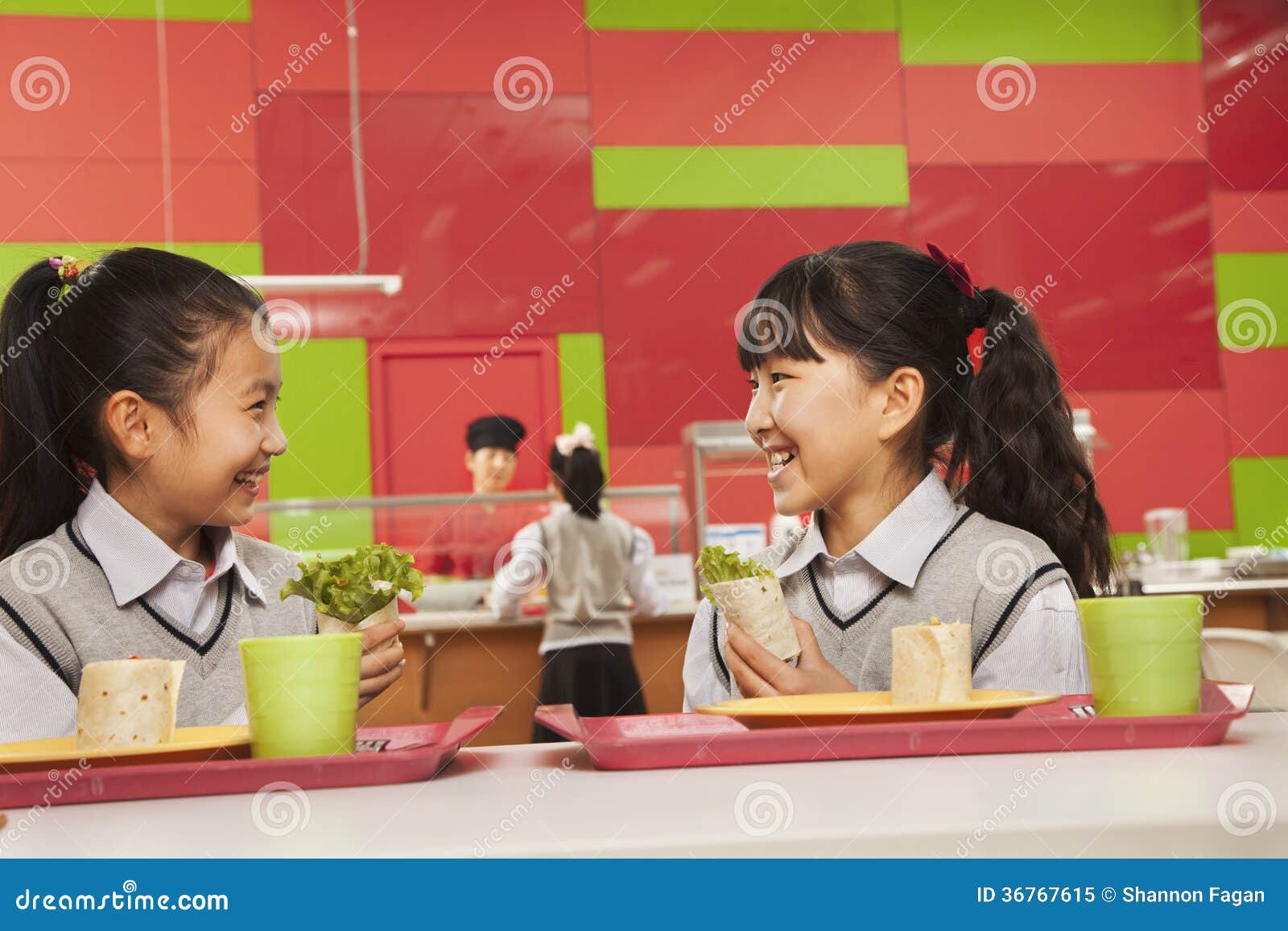 Two Girls Talking at Lunch in School Cafeteria Stock Image - Image of ...