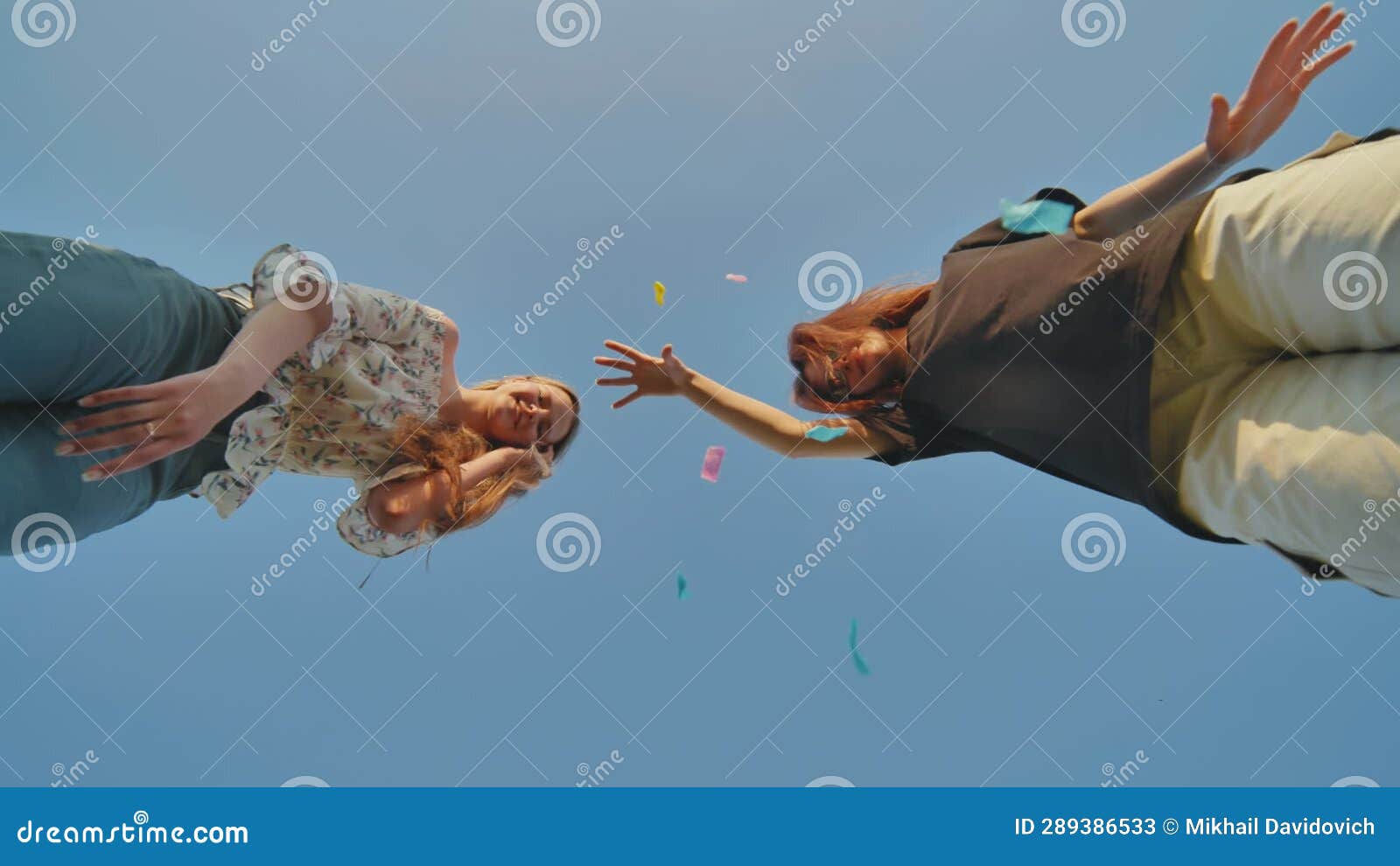 Two Girls Throwing Down Confetti. Stock Video - Video of adult, young ...